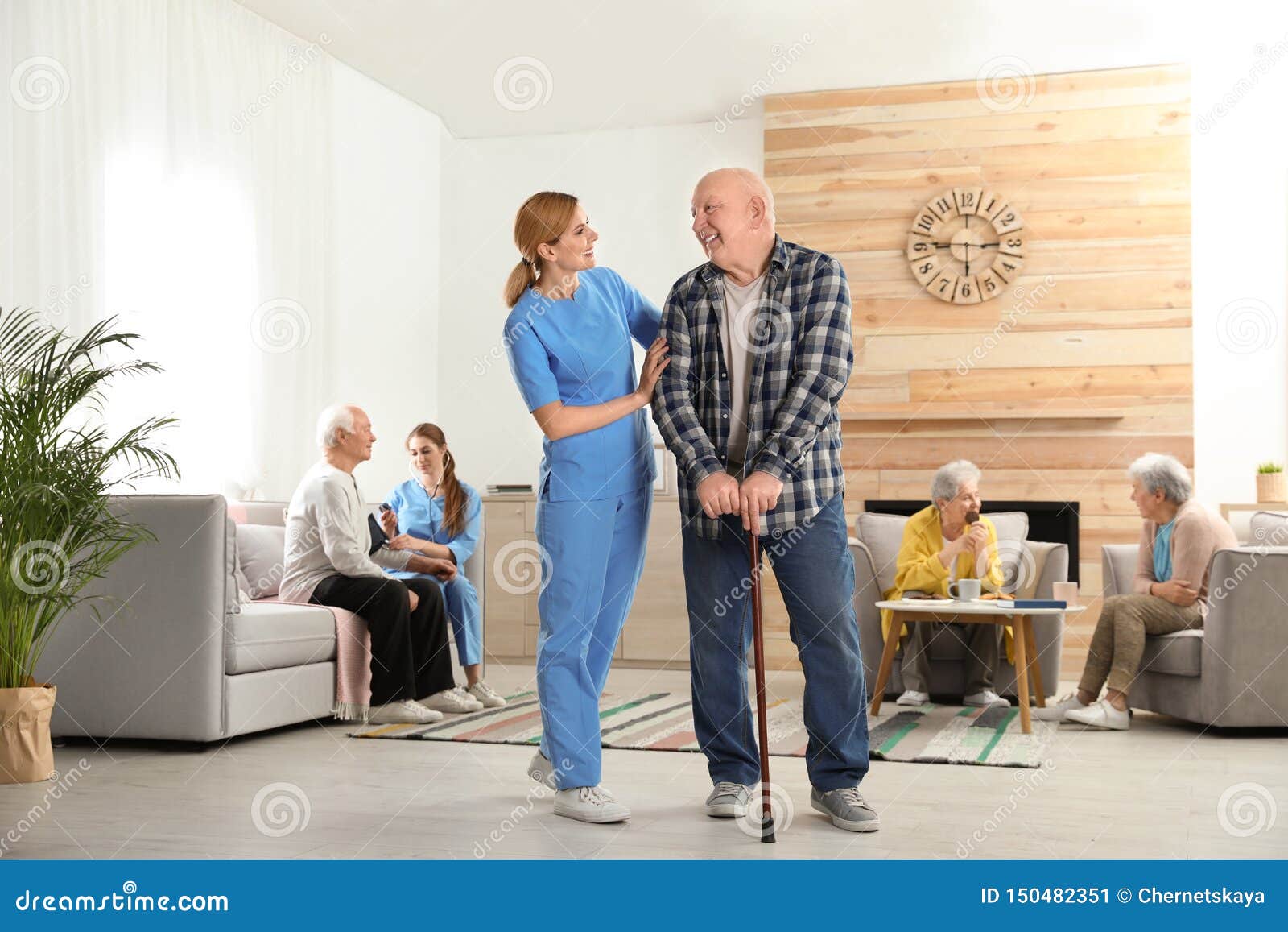 Nurses Assisting Elderly People Stock Image - Image of indoors, happy ...