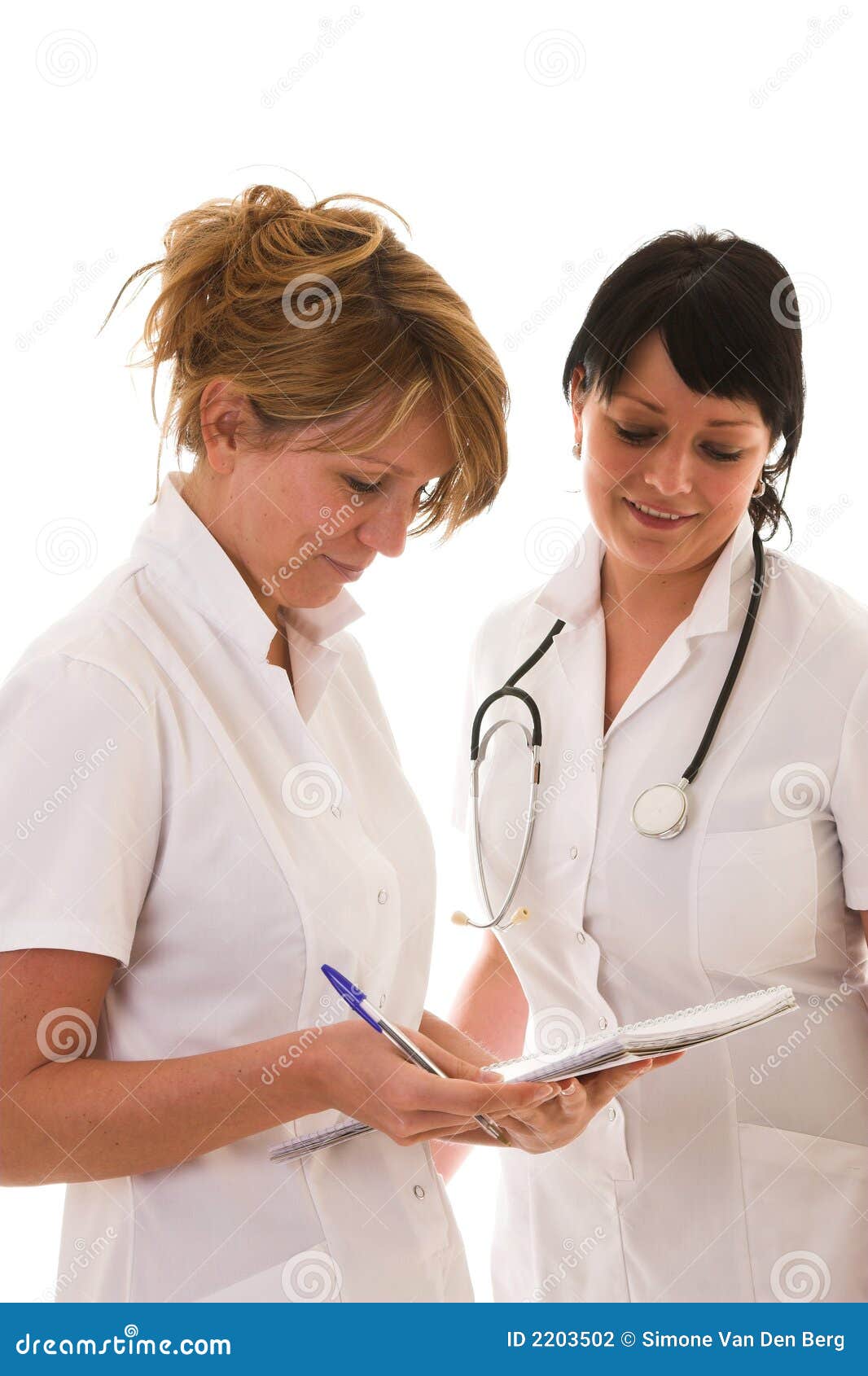 Nurses Checking Out the Notes Stock Photo - Image of pretty, smiling ...