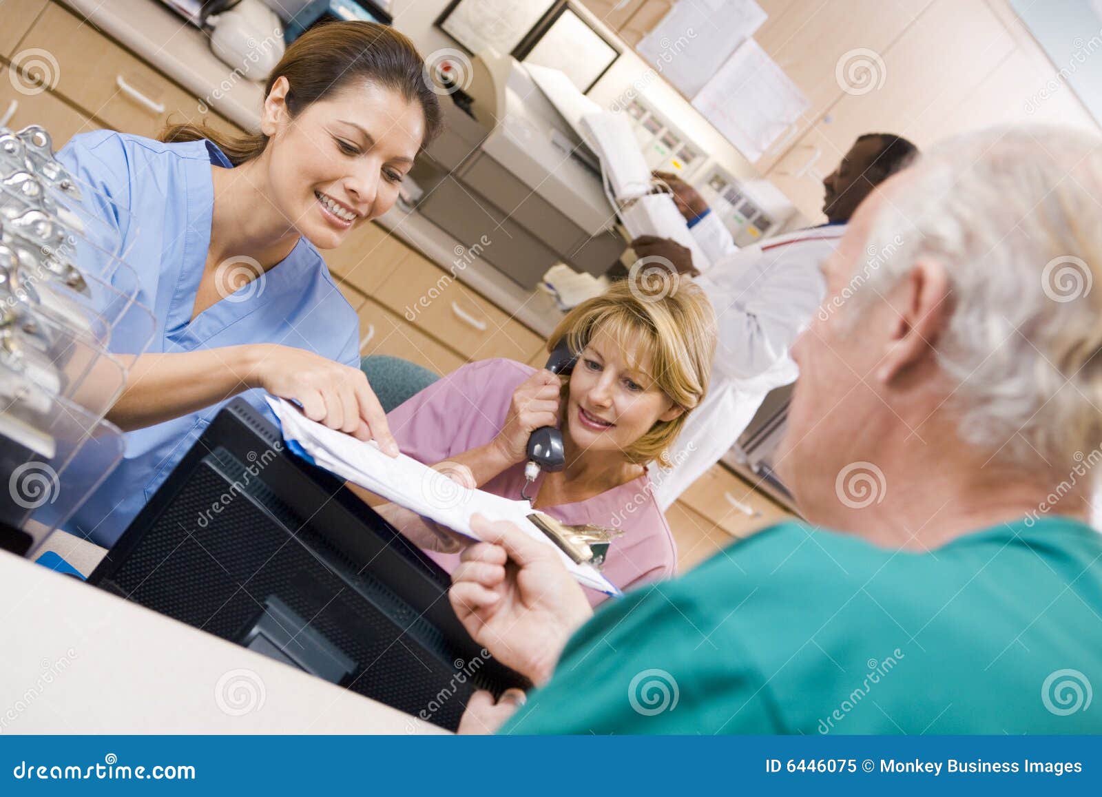 Nurses Discussing a Clipboard Stock Image - Image of hospital ...