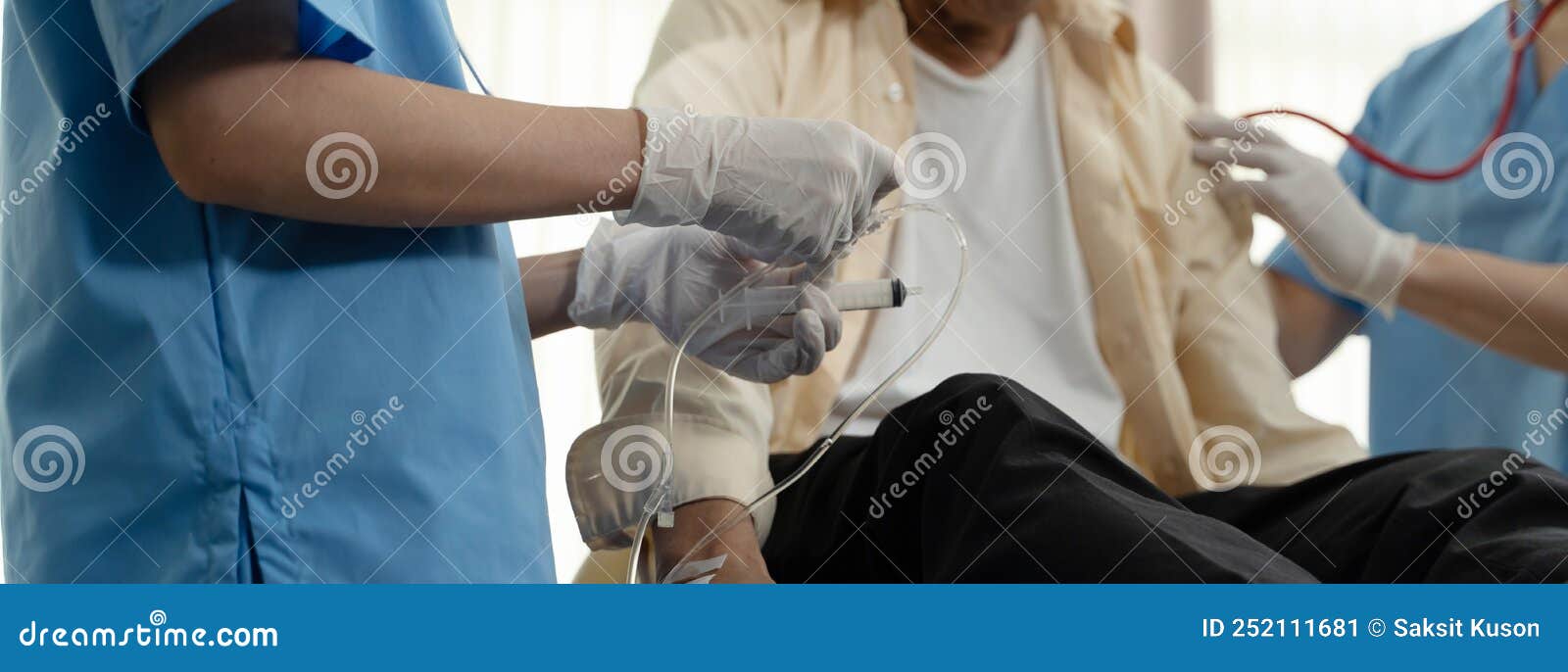 Nurses and Doctors Inject Saline Solution To Patient. Stock Image ...
