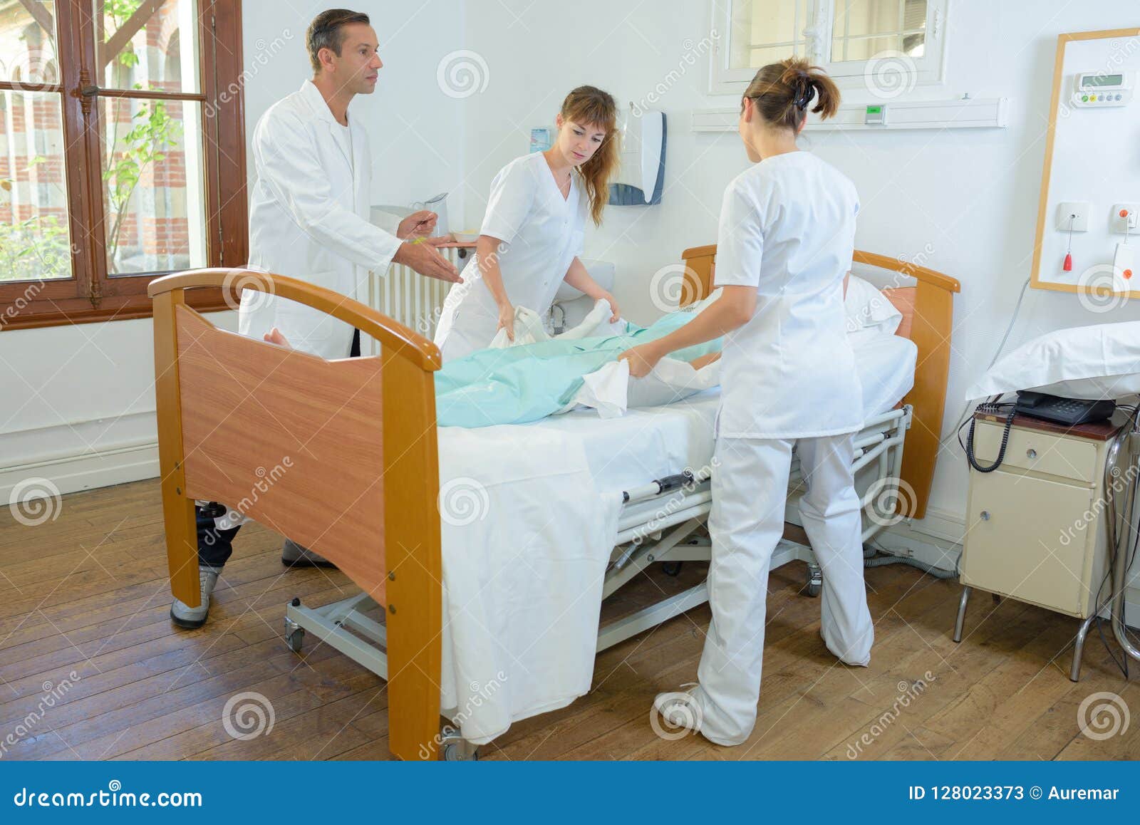 Nurses Lifting Patient Under Doctor`s Supervision Stock Image - Image ...