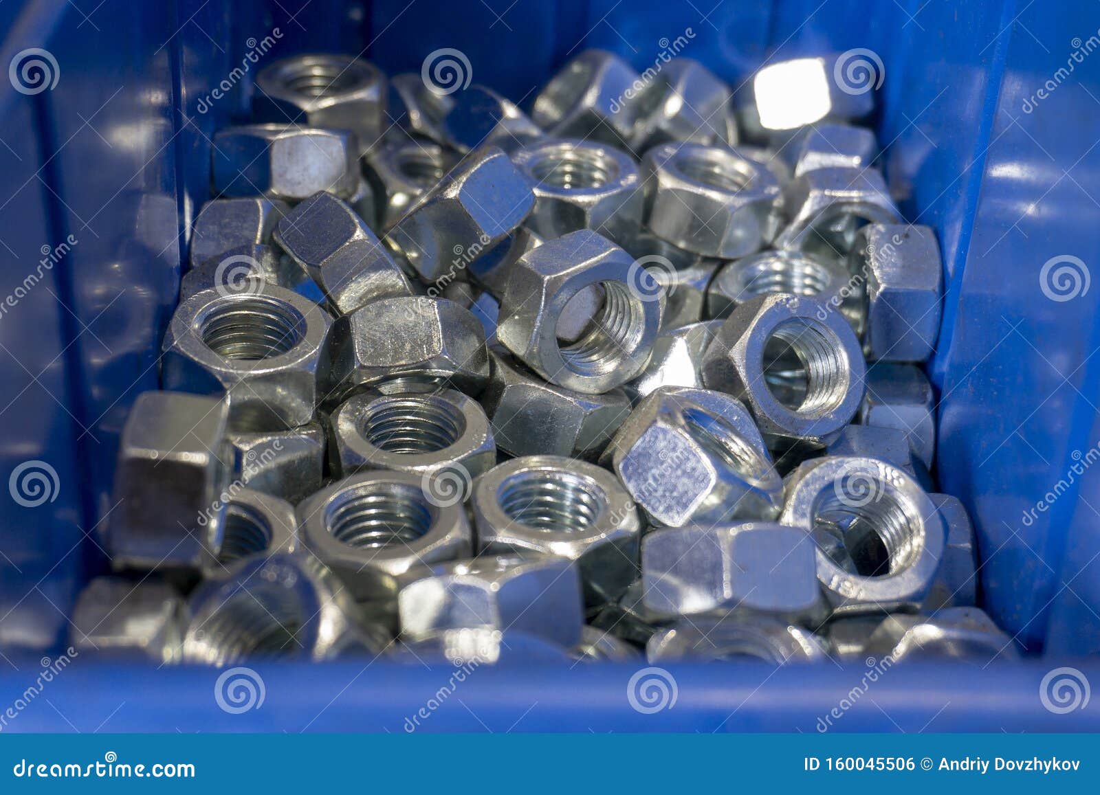 Nut Fixing Connection, Set of New Nuts in a Blue Box Stock Photo ...