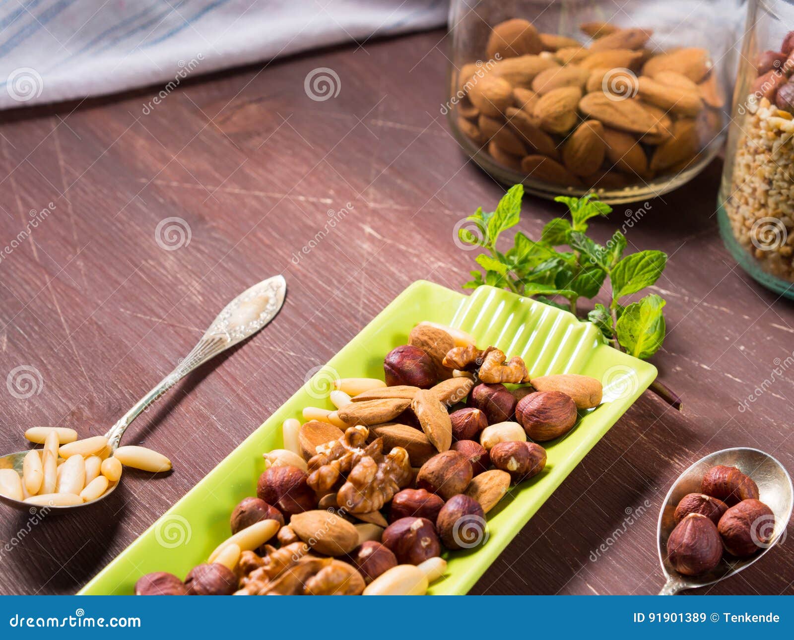 Nut mix on green dish stock image. Image of spoon, background - 91901389