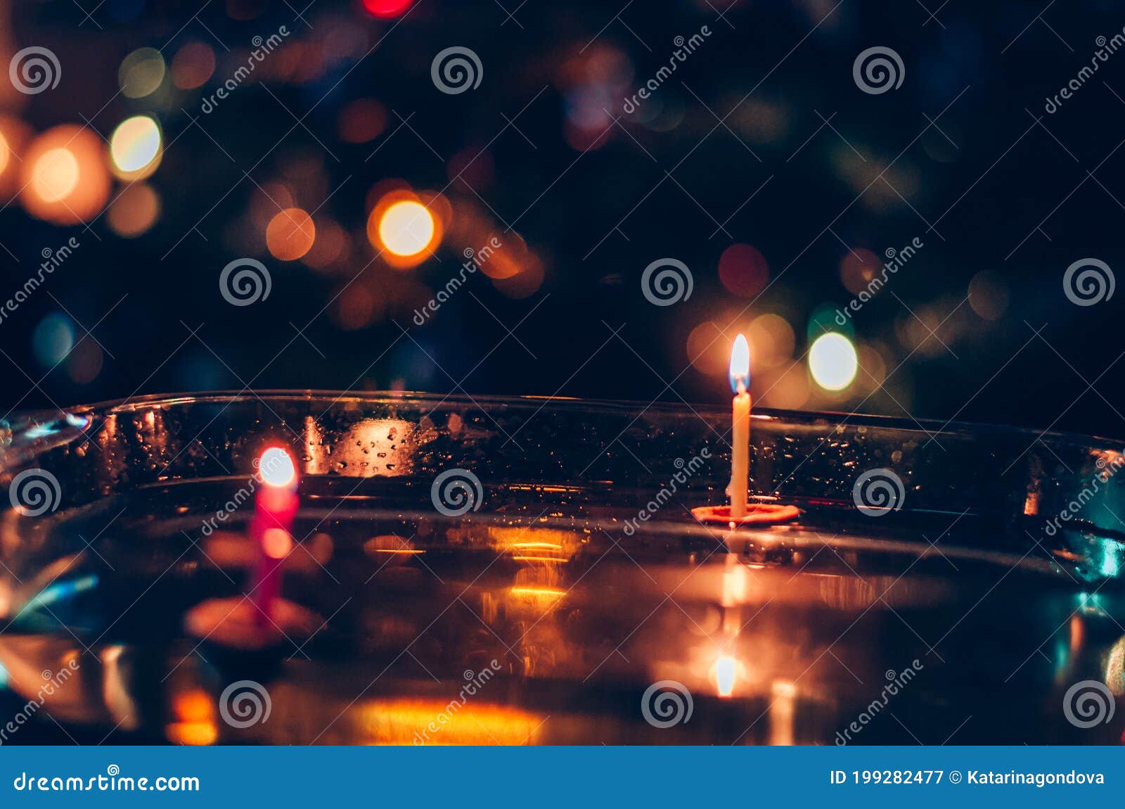 Nut Shell with Burning Candle Floating on Water Stock Image - Image of ...