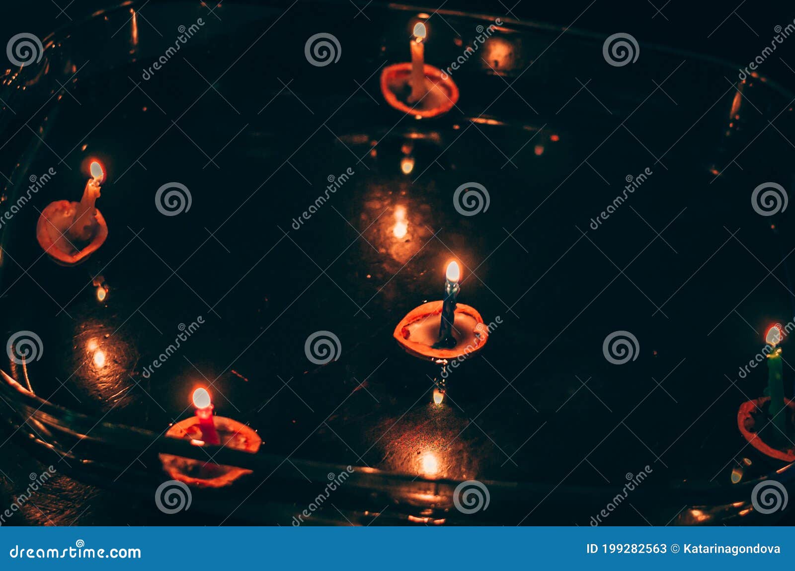 Nut Shell with Burning Candle Floating on Water Stock Image - Image of ...