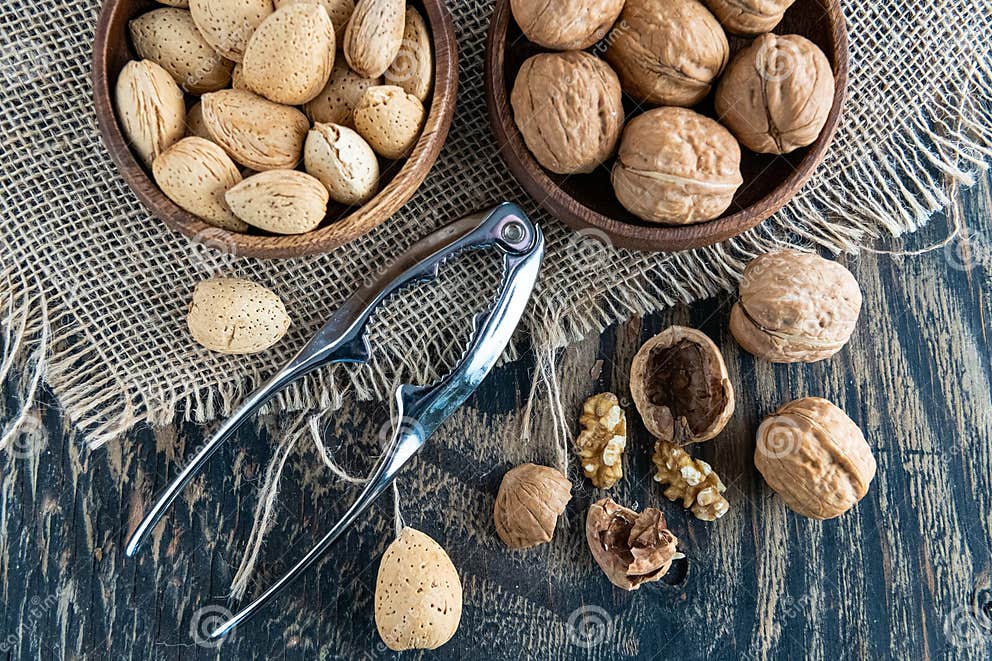 Nutcracker for Cracking Nuts and Assorted Nuts in a Wooden Bowls. Top ...