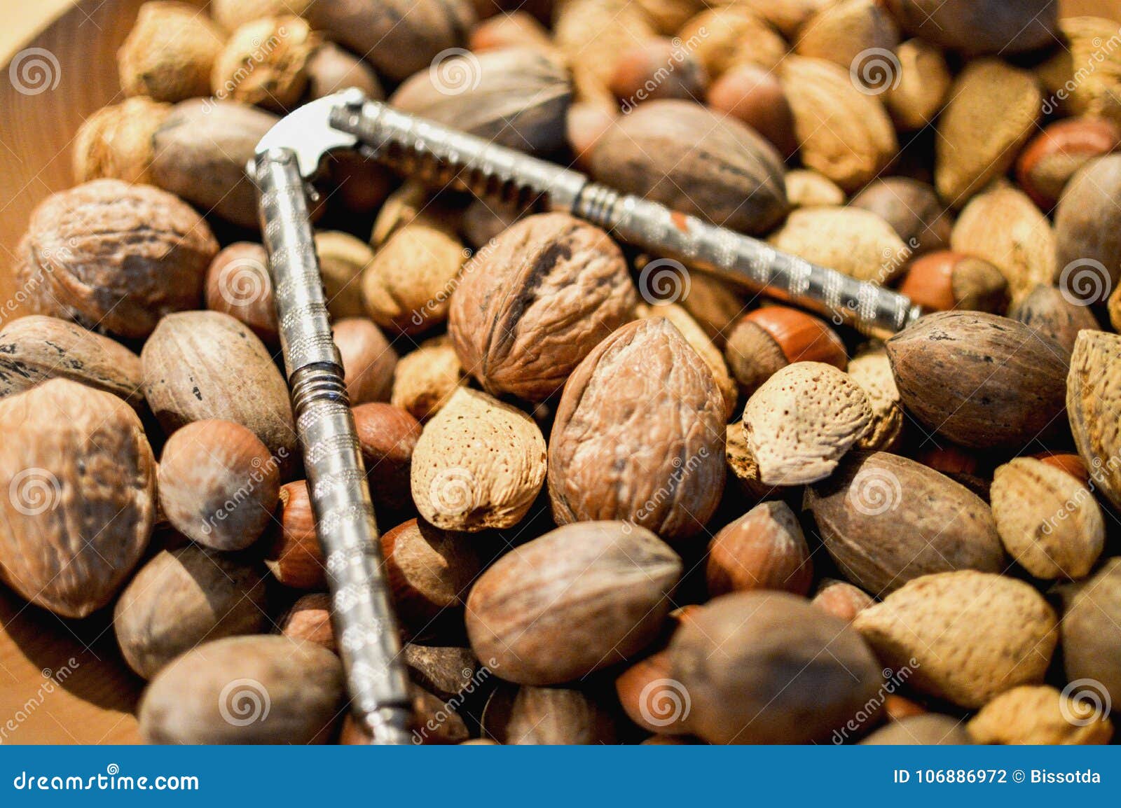 Getting Nutty with Nutcracker on Brown Nuts Stock Photo - Image of nuts ...