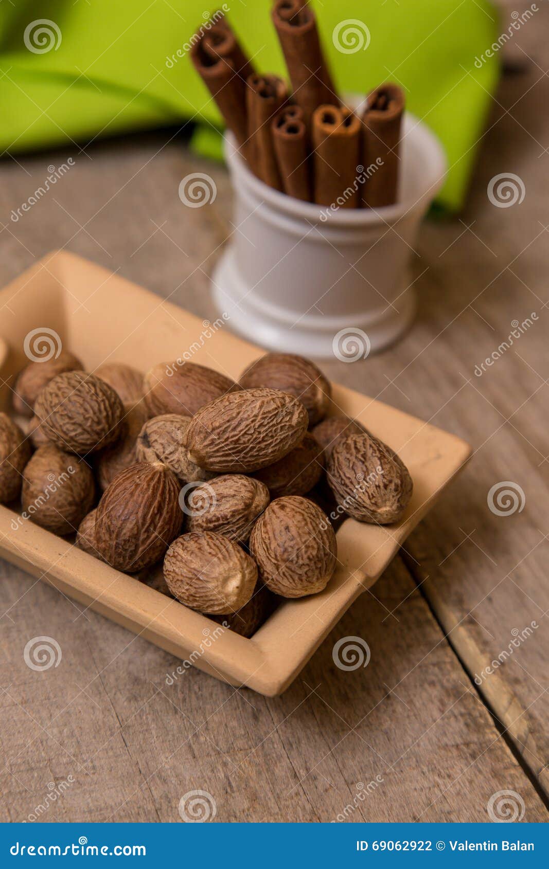Nutmeg in a ceramic plate stock photo. Image of scented - 69062922