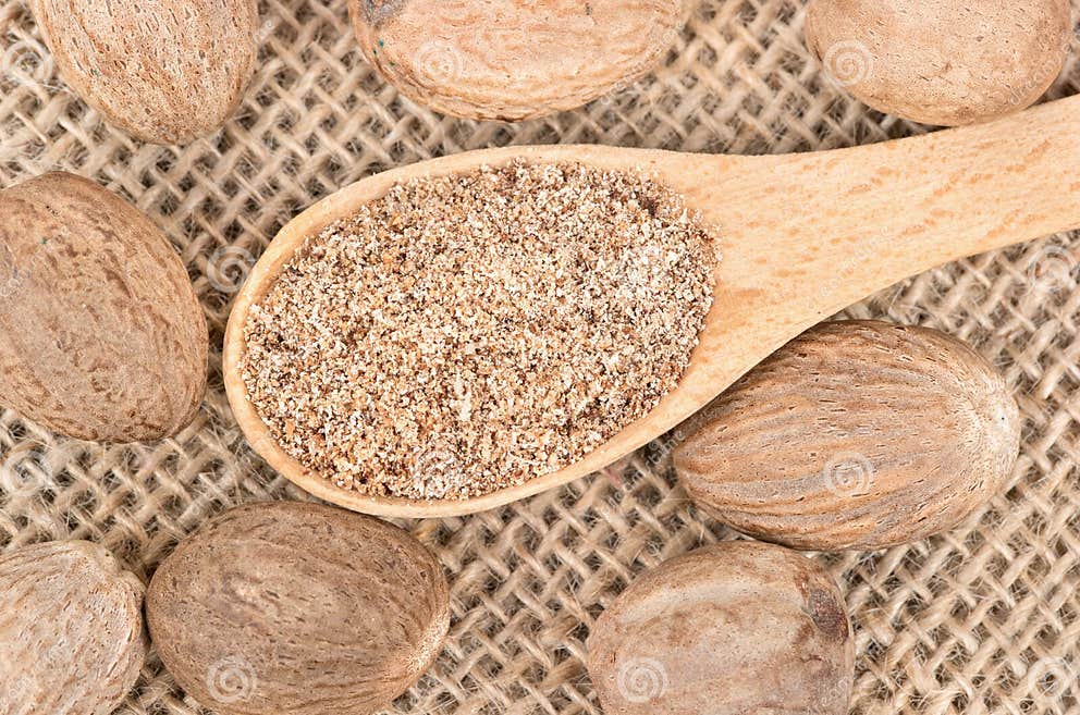 Nutmeg in spoon stock photo. Image of cooking, aromatic - 94457296