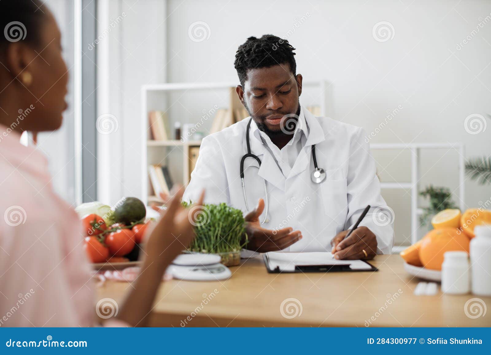 Nutrition Expert Making Notes during Talk with Patient Stock Image ...