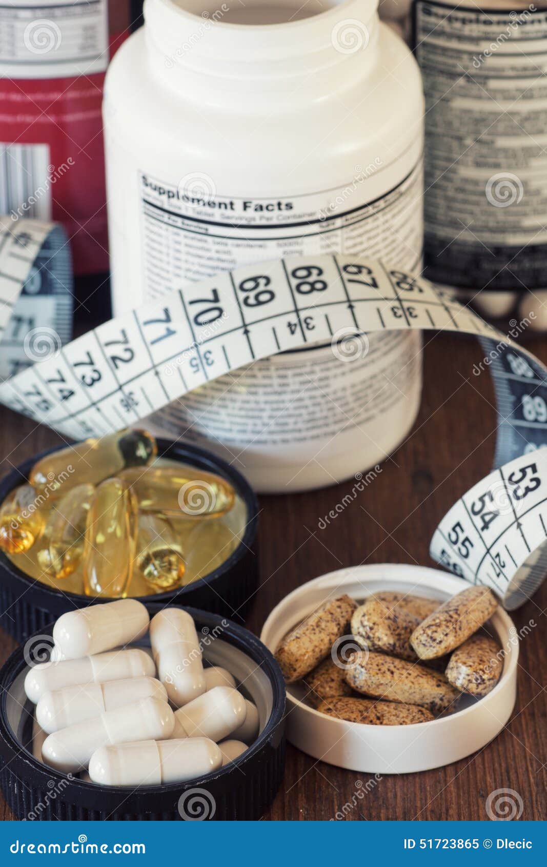 Nutritional Supplements in Capsules and Tablets, on Wooden Background ...