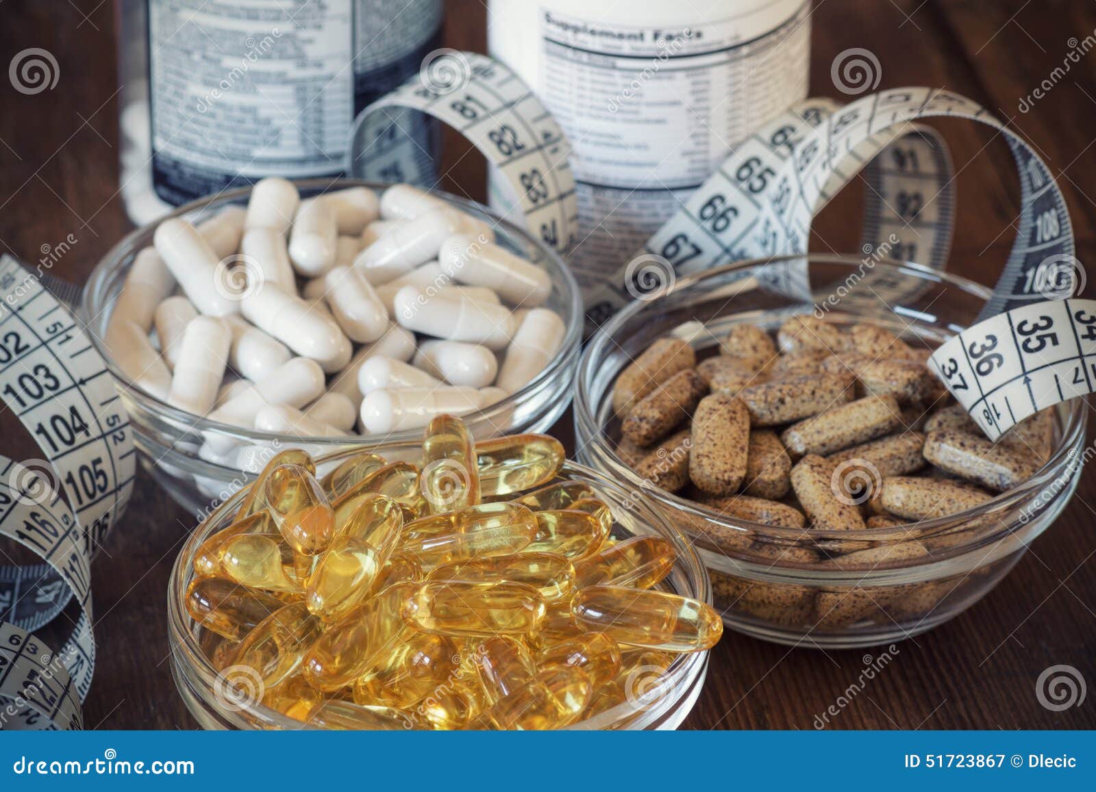 Nutritional Supplements in Capsules and Tablets, on Wooden Background ...
