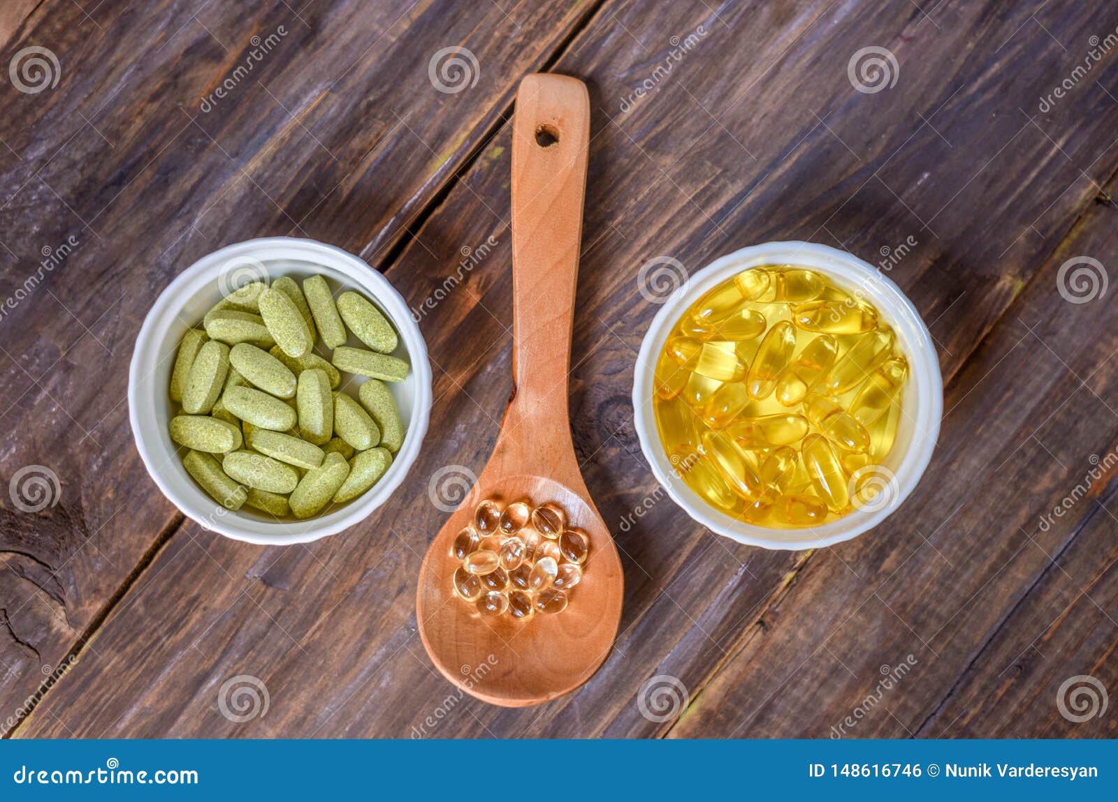 Various Dietary Supplements on Wooden Background Stock Photo - Image of ...