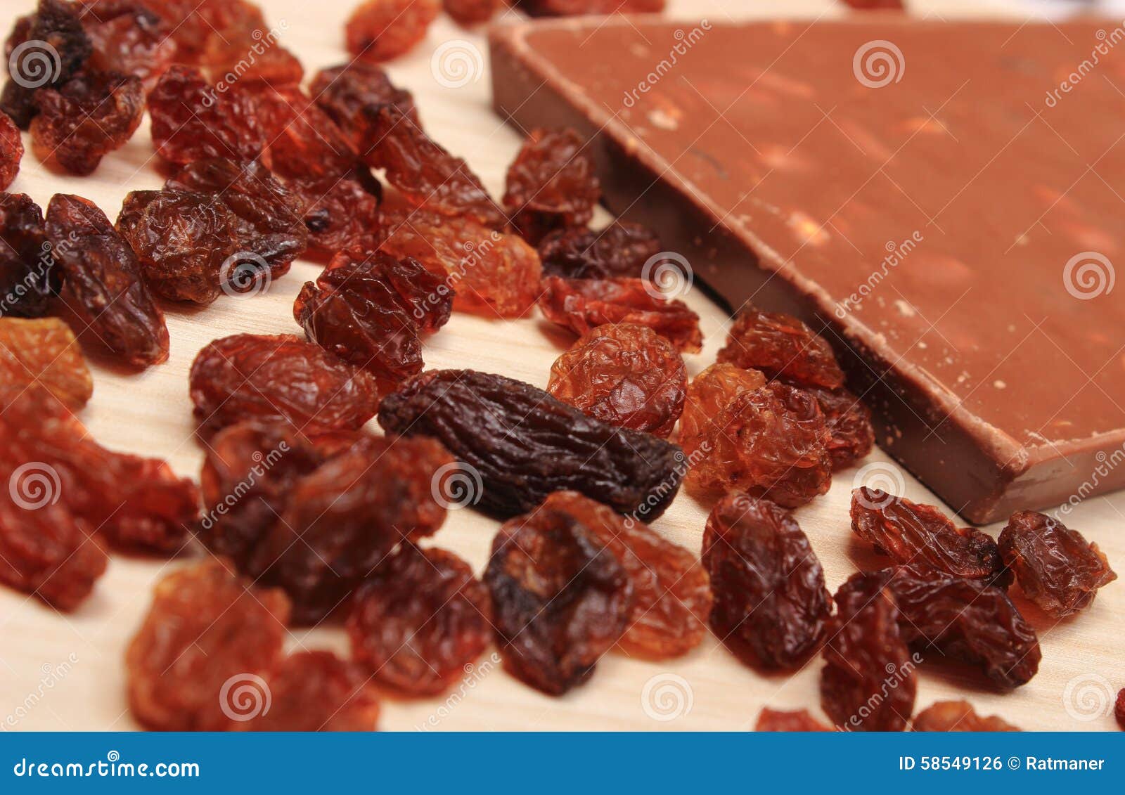 Nutritious Chocolate with Nuts and Raisins on Wooden Table Stock Photo ...
