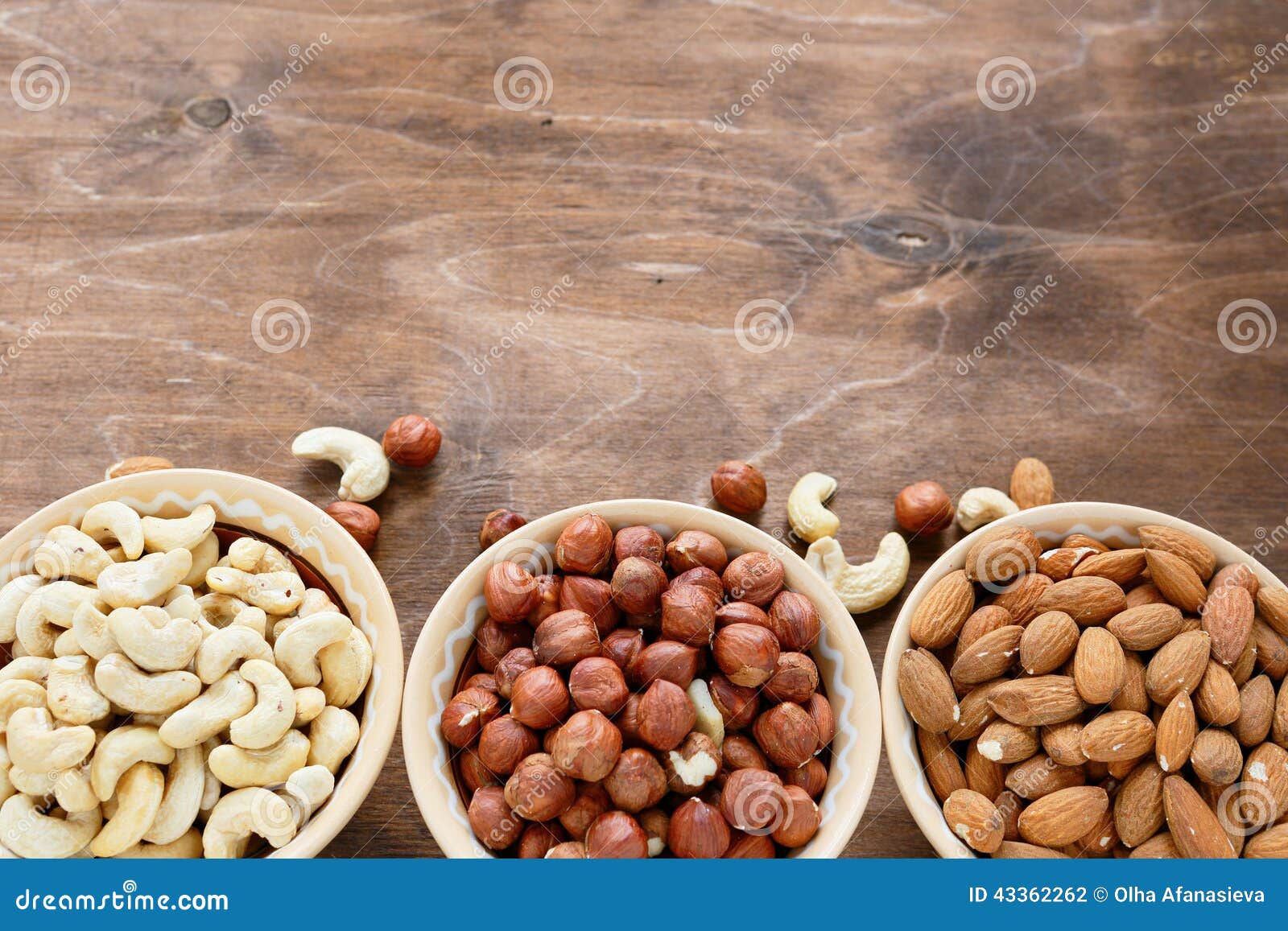 Nuts in bowls, top view stock photo. Image of assortment - 43362262