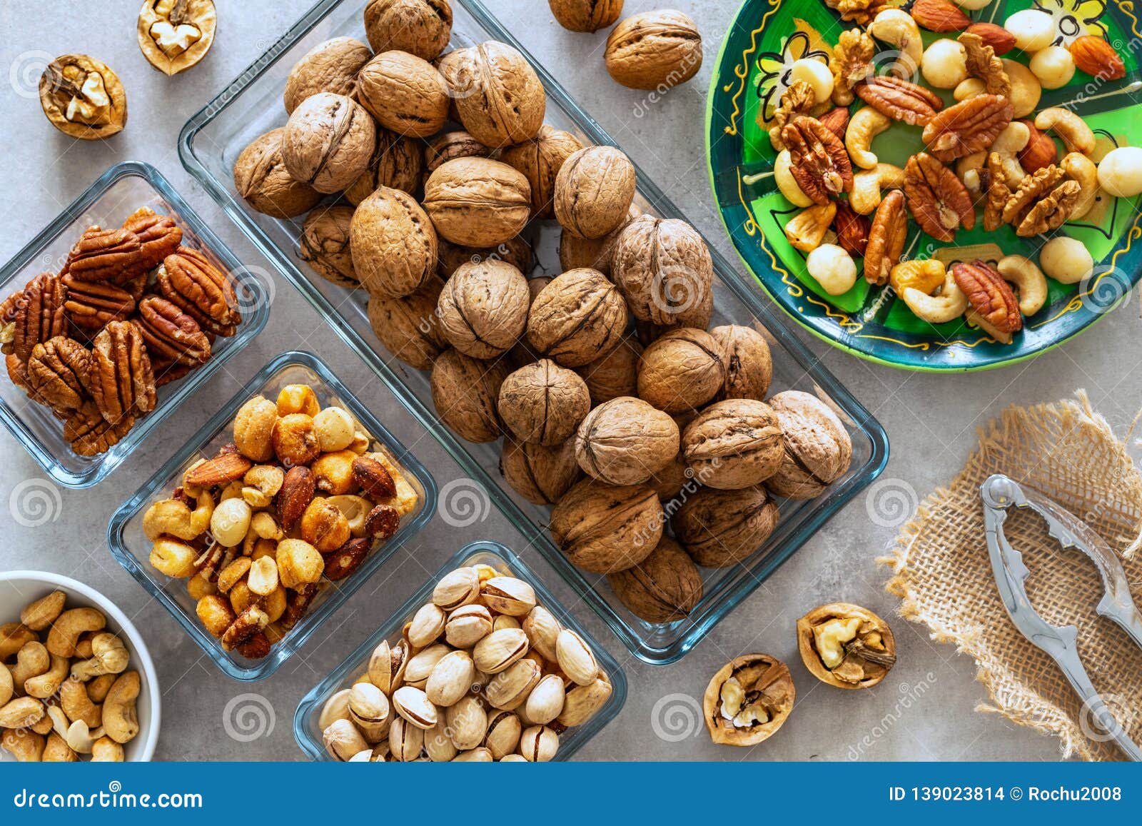 Nuts Of Different Varieties On A Plate On The Background Of The Table ...