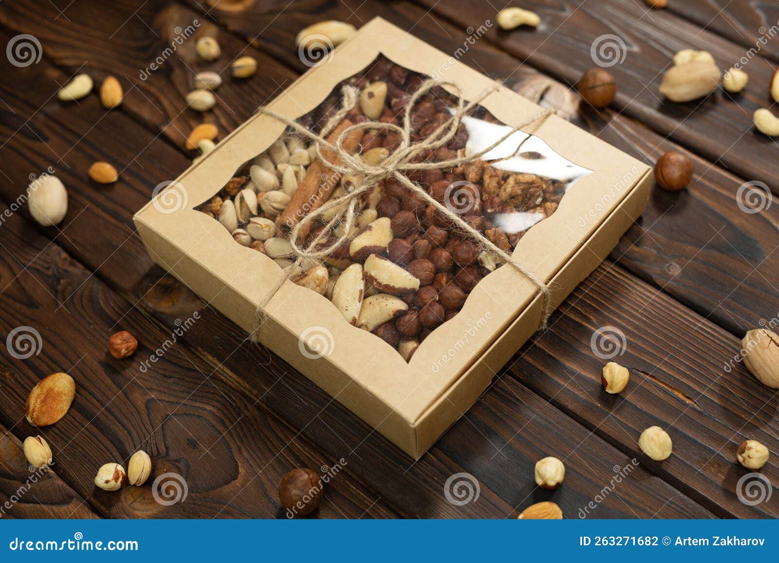Nuts of Different Varieties in a Box on a Structural Wooden Background ...