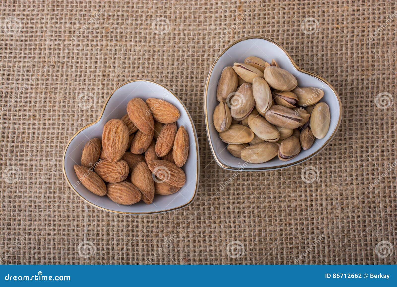 Nuts in Heart Shaped Plates on Canvas Stock Photo - Image of shell ...