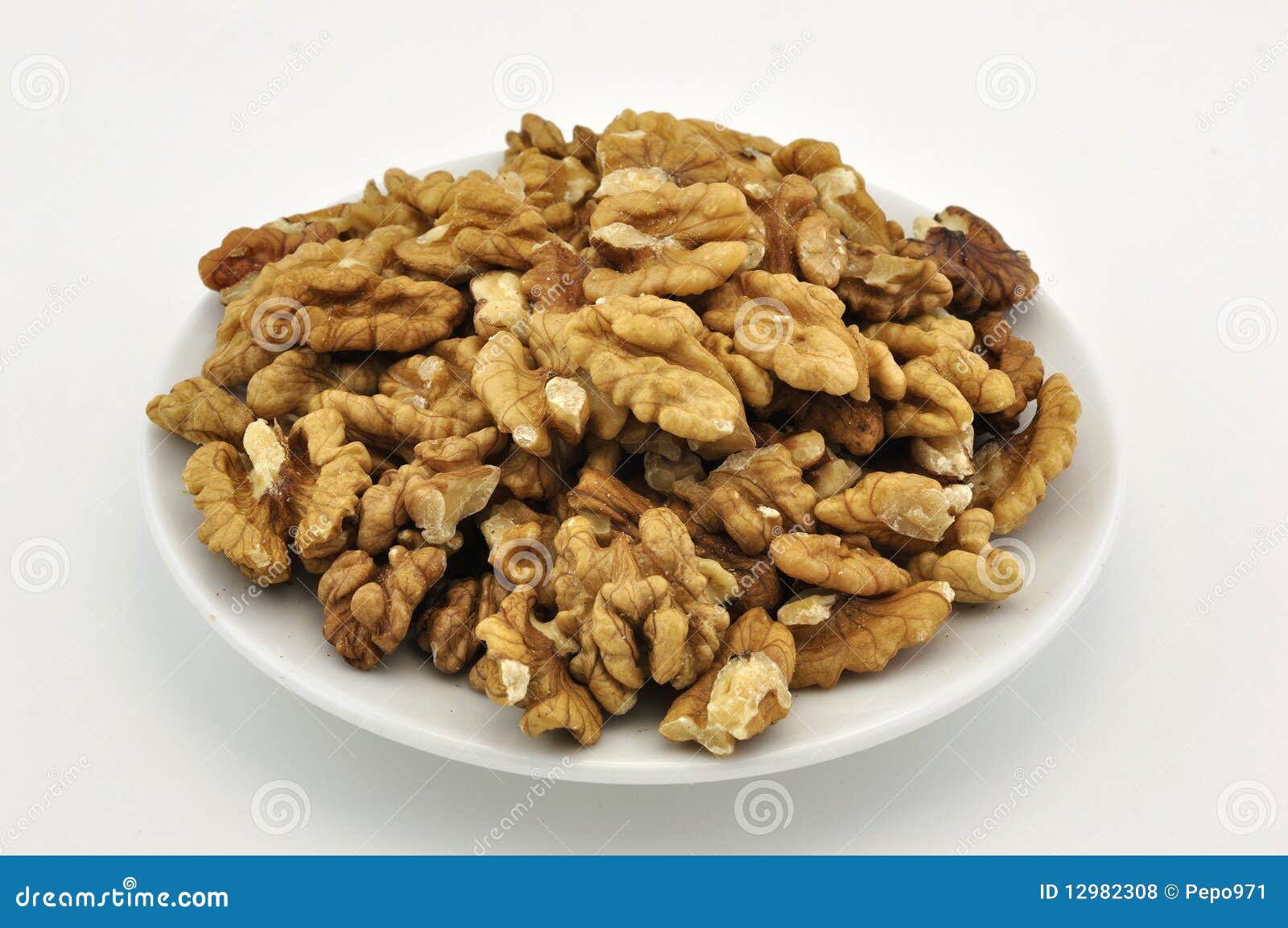 Nuts on plate stock photo. Image of aliment, nuts, nutritive - 12982308