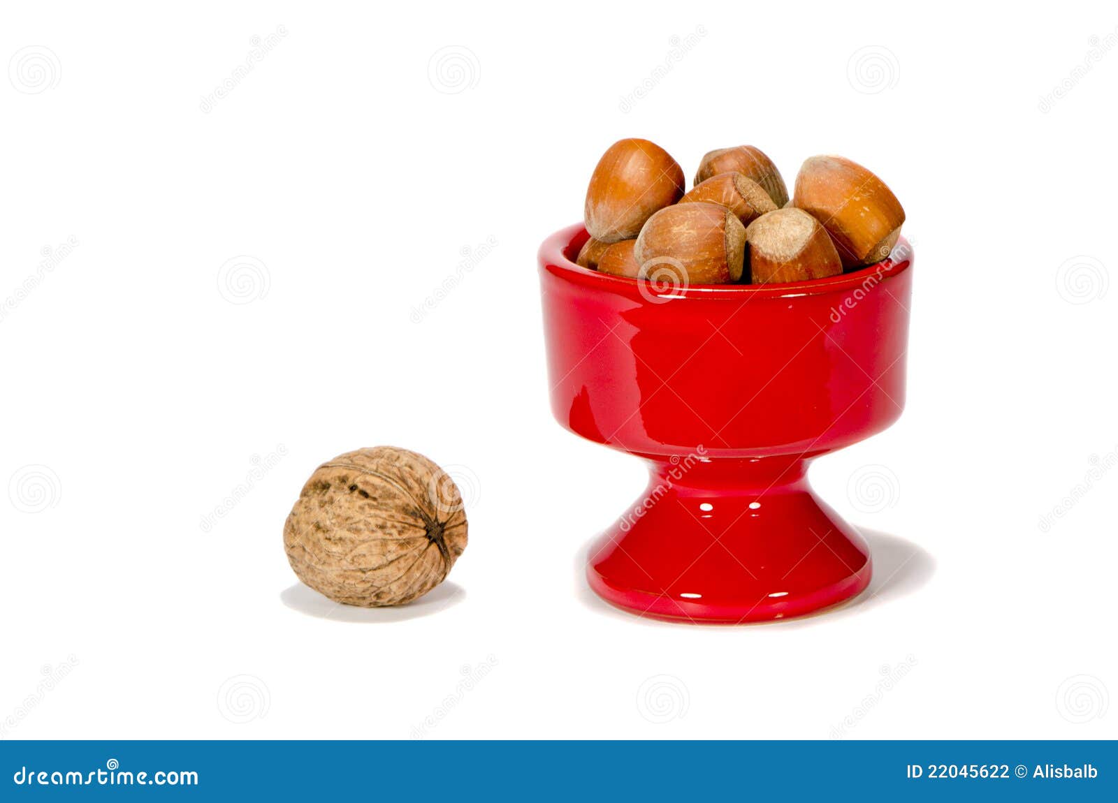 Nuts and red vase on white stock photo. Image of decorative - 22045622