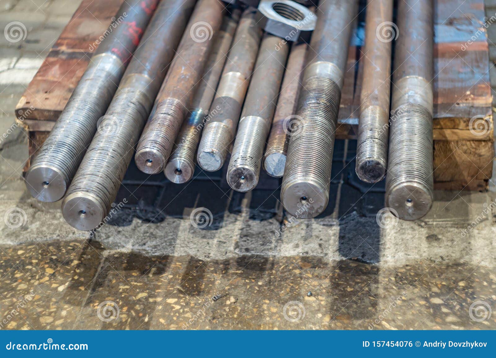 Nuts and Studs after Turning the Threading on the Rack in the Workshop ...