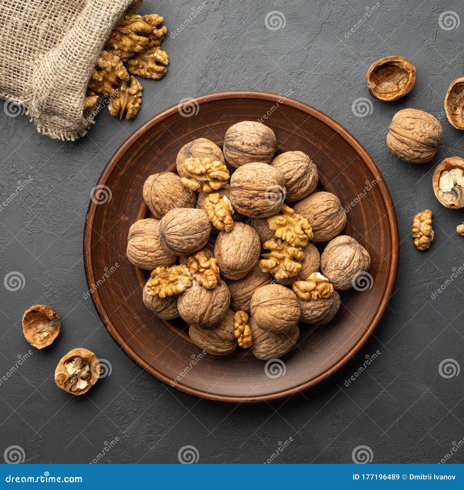 Nuts. Walnut Kernels and Whole Walnuts on Dark Stone Table Stock Image ...