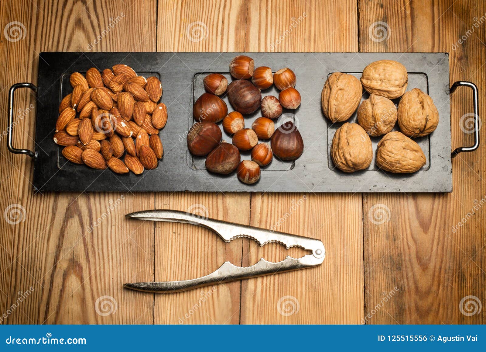 Nuts on a Wooden Table with a Nutcracker Stock Photo - Image of ...
