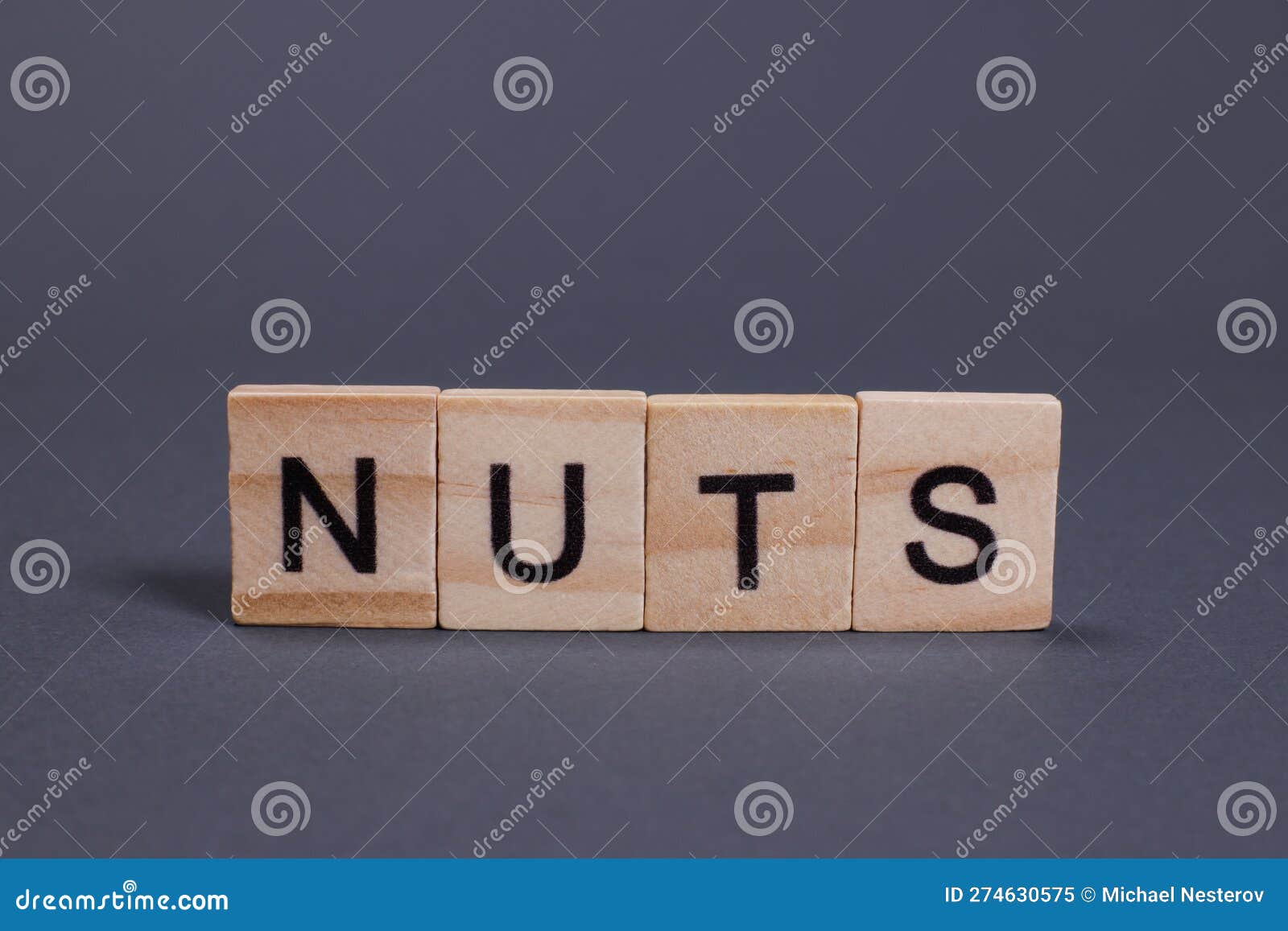 Nuts Word from Wooden Letters on a Gray Background Stock Image - Image ...
