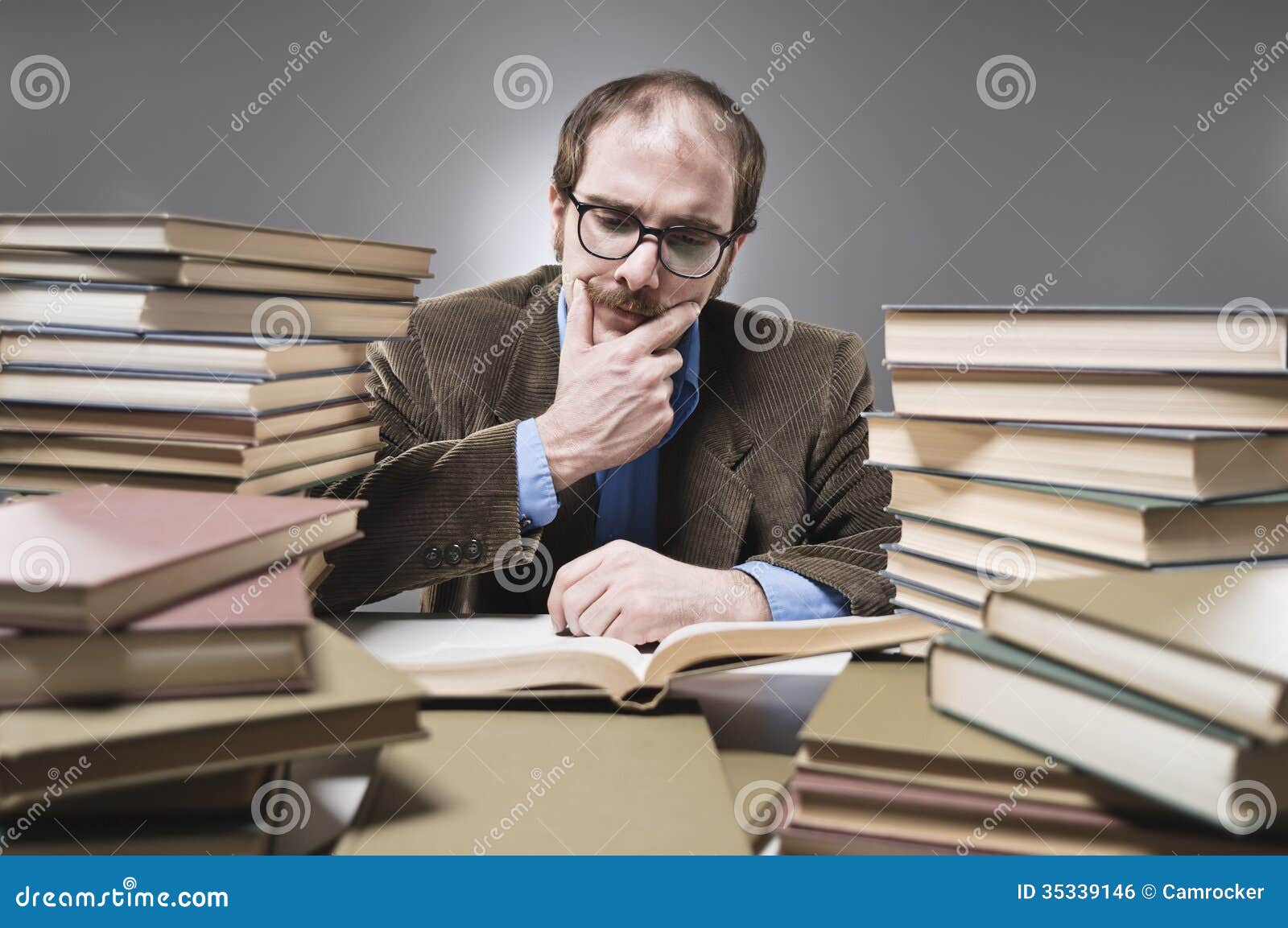 Nutty Professor in between a Stack of Books Stock Photo - Image of ...