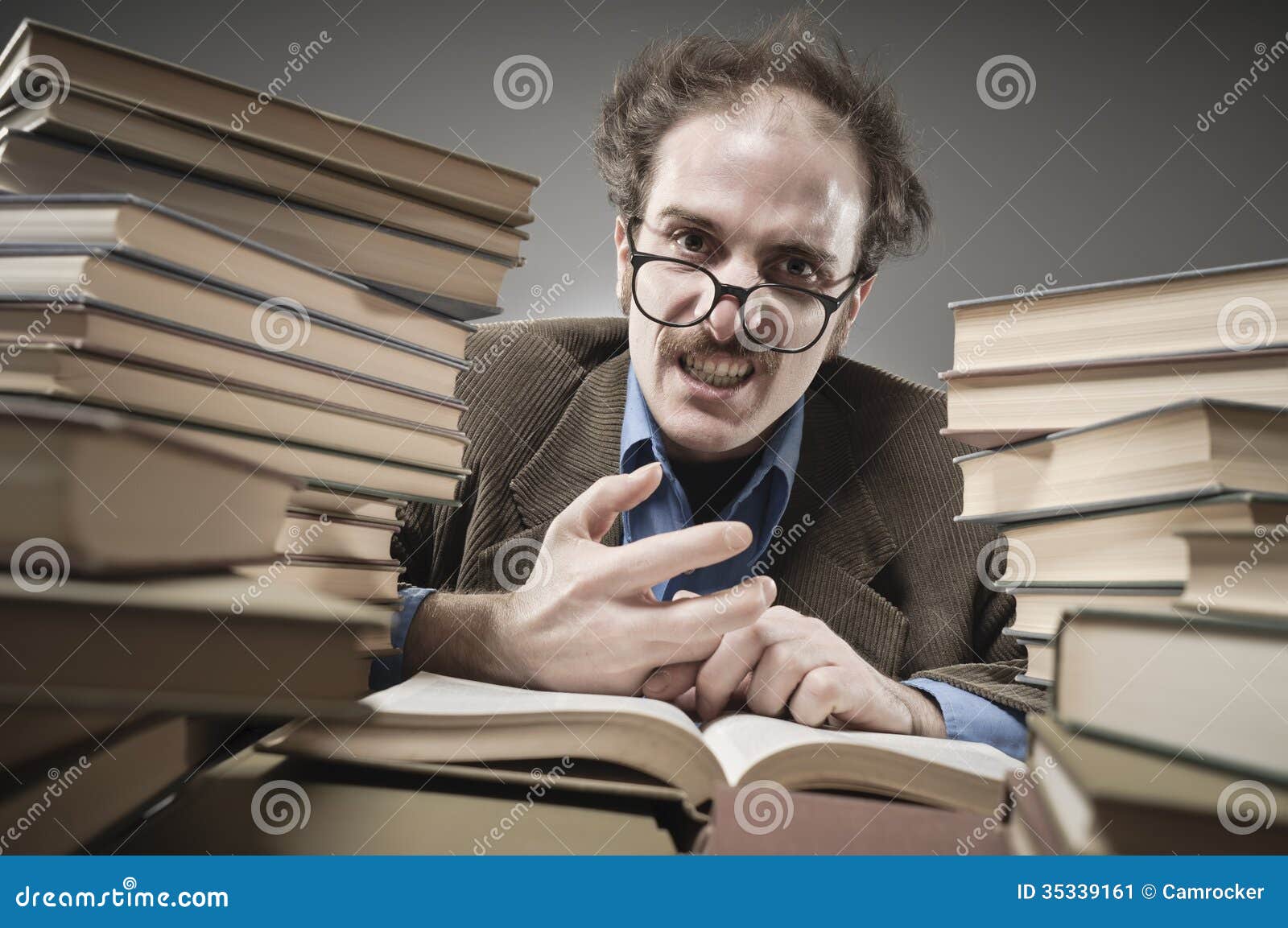 Nutty Professor in between a Stack of Books Stock Image - Image of ...