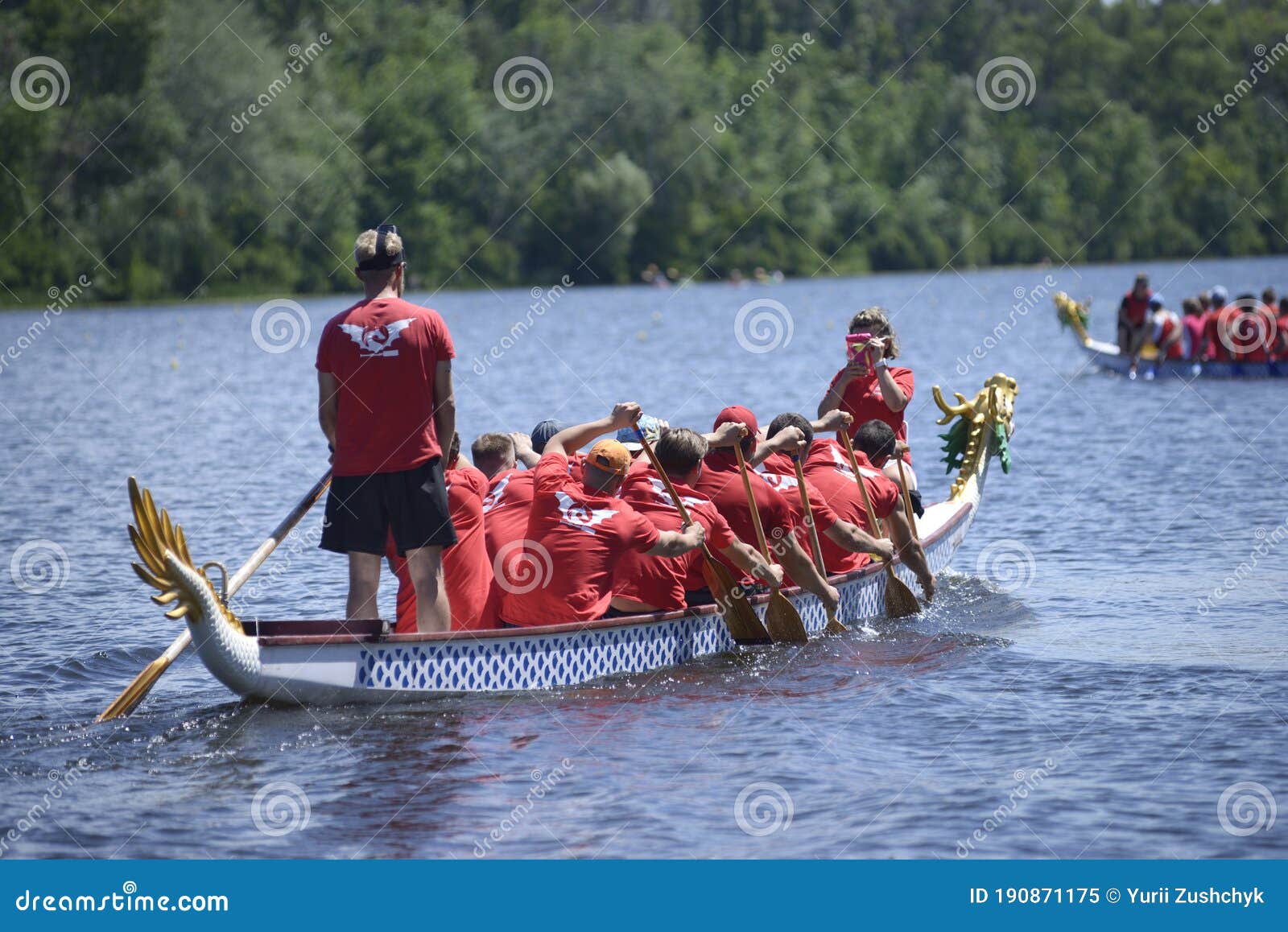 Oarsmen Rowing a Dragon Boat on a River. Kiev Oblast Championship among ... Oarsmen Rowing a Dragon Boat on a River. Kiev Oblast Championship among ...