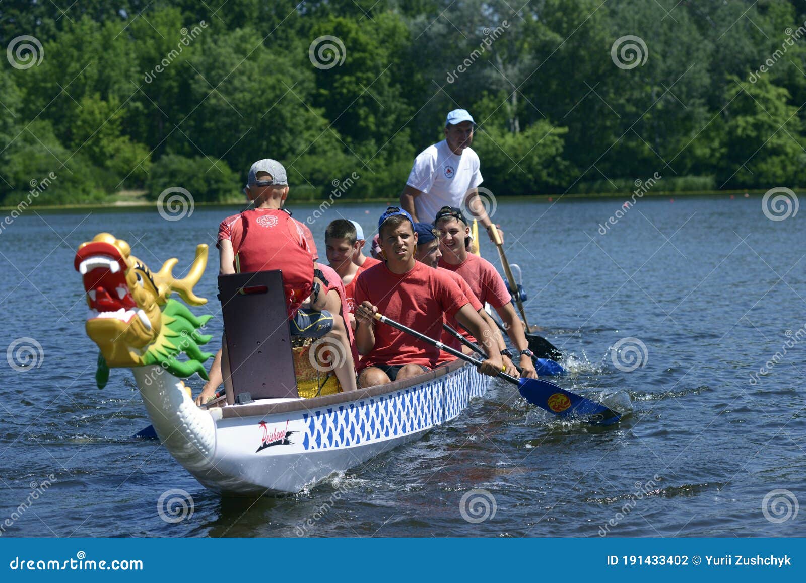 Oarsmen Rowing a Dragon Boat on a River. Kiev Oblast Championship among ... Oarsmen Rowing a Dragon Boat on a River. Kiev Oblast Championship among ...