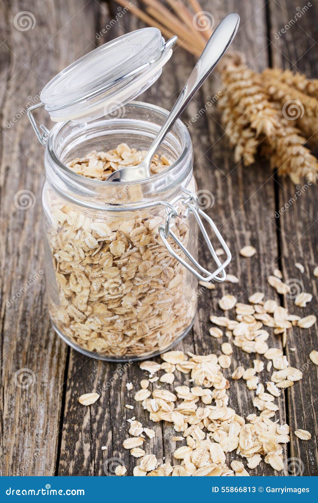Oat Flakes Spilled Out from Jar and Wheat. Stock Image - Image of ...