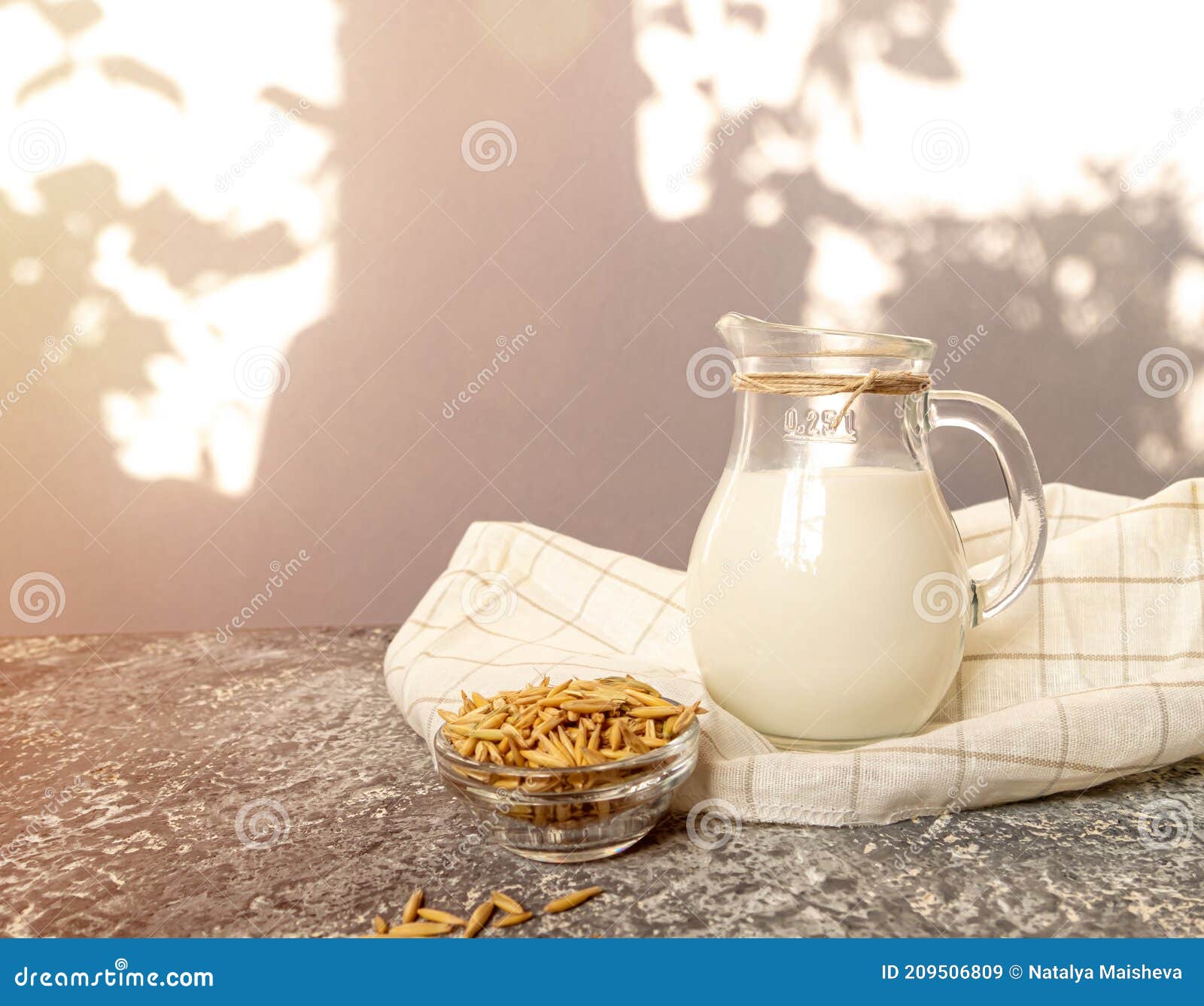 Oat Milk in a Jug and Oat Grains.a Healthy Snack or Breakfast Stock ...