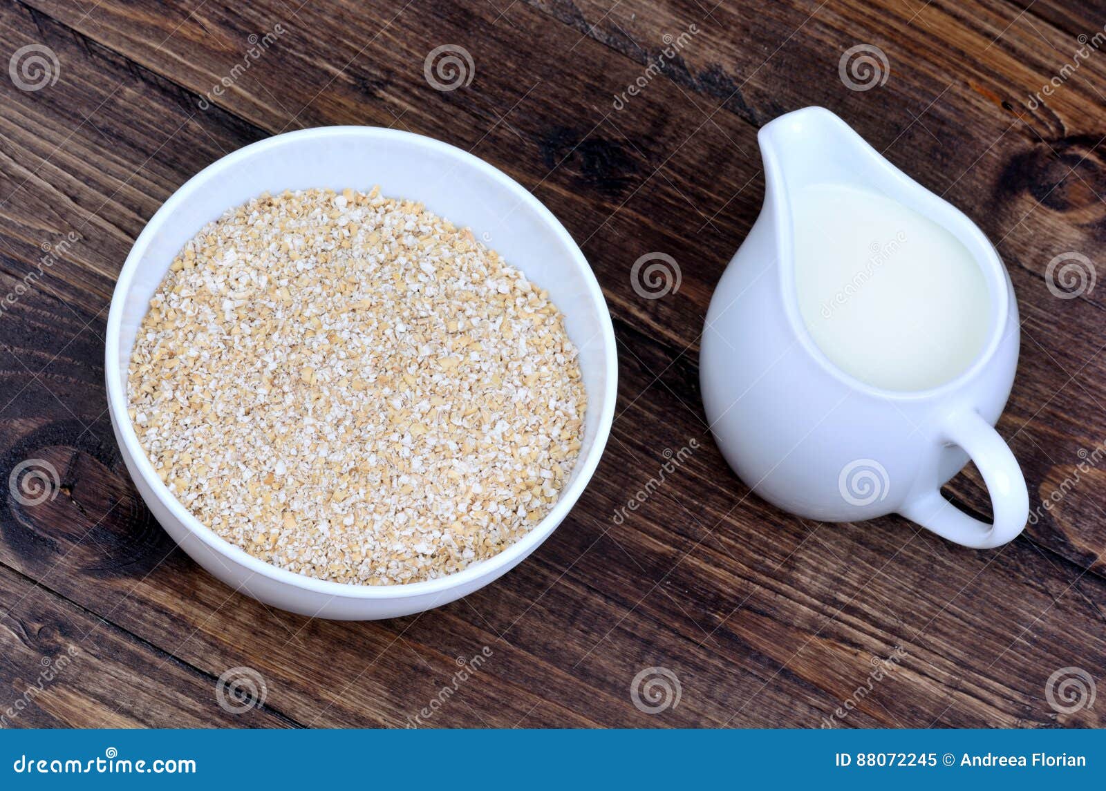 Oatmeal in a Ceramic Bowl and Pitcher with Milk on Table Stock Image ...
