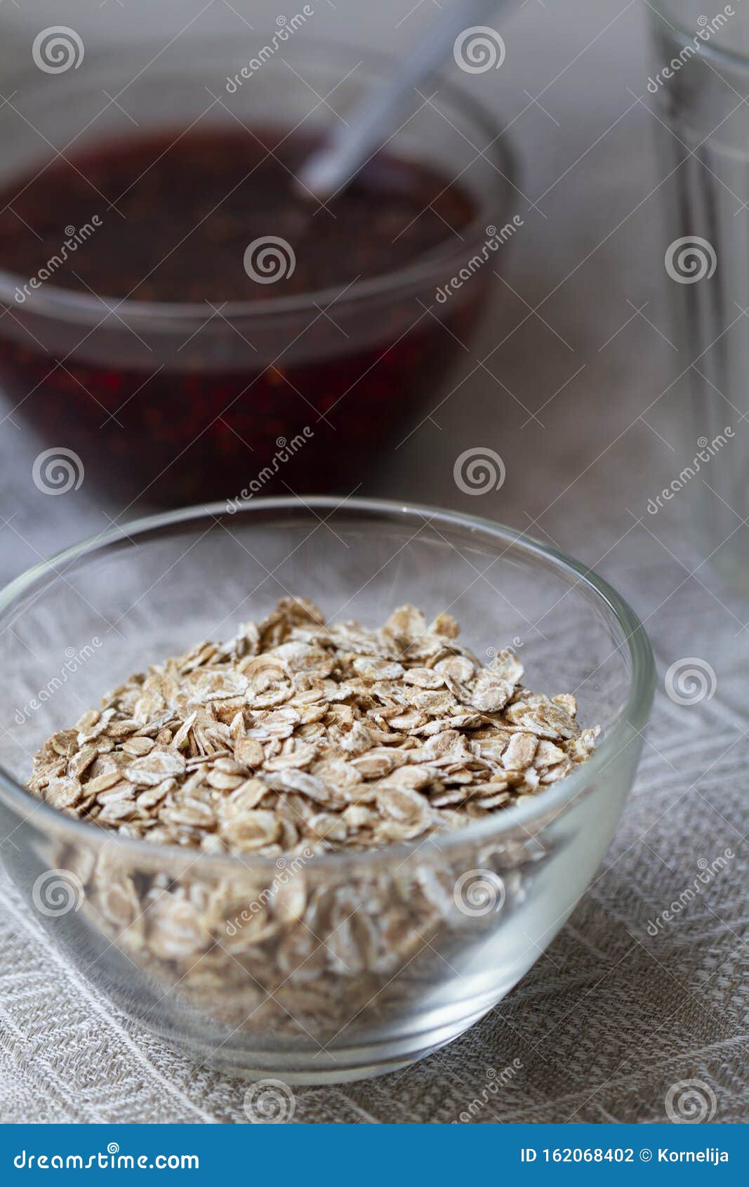Oatmeal in a glass bowl stock photo. Image of bowl, meal - 162068402