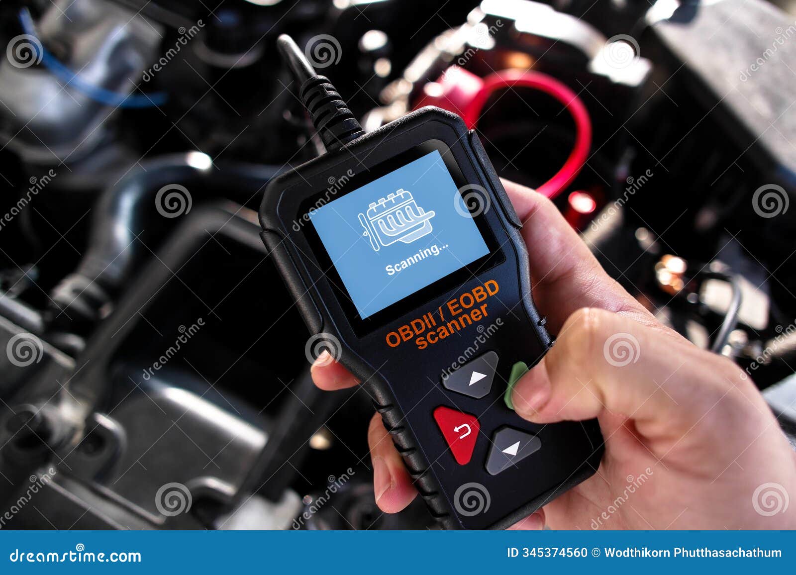 OBDII Scanner in Use Under the Hood by Auto Mechanic for Reading Fault ...