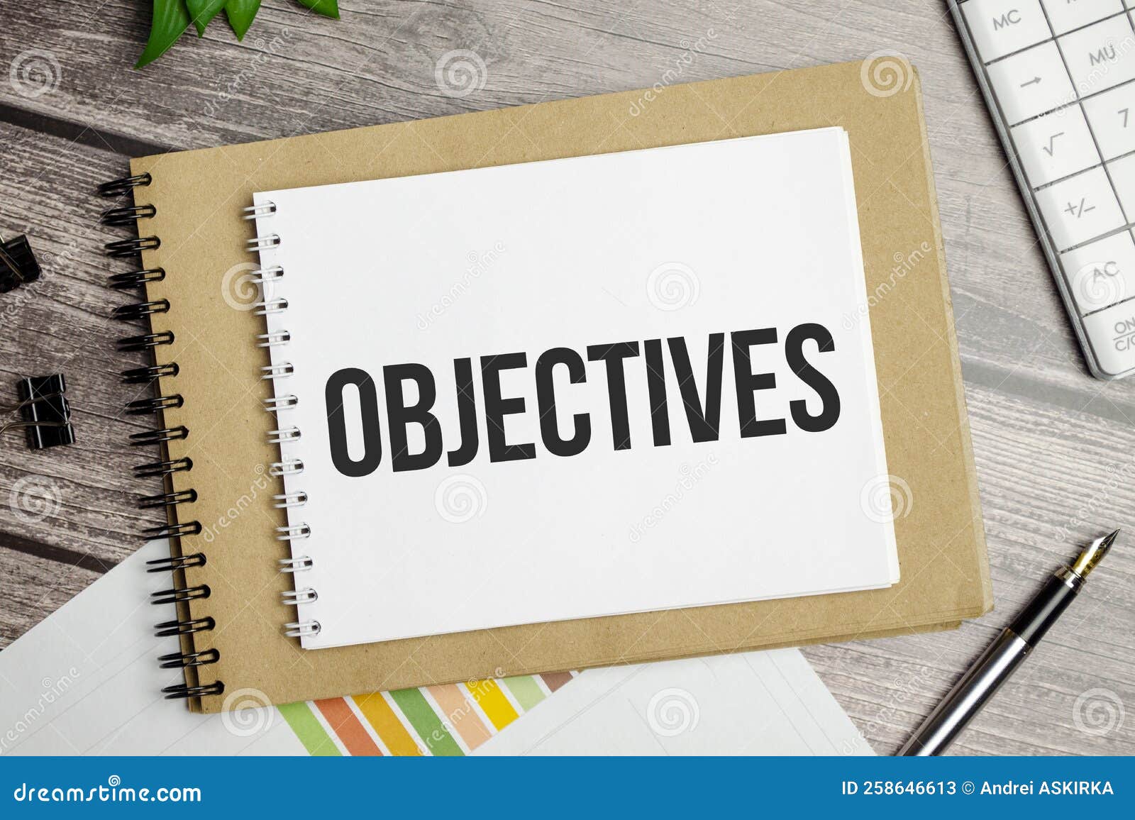 OBJECTIVES Word on White Notebook and Charts, Pen and Calculator Stock ...