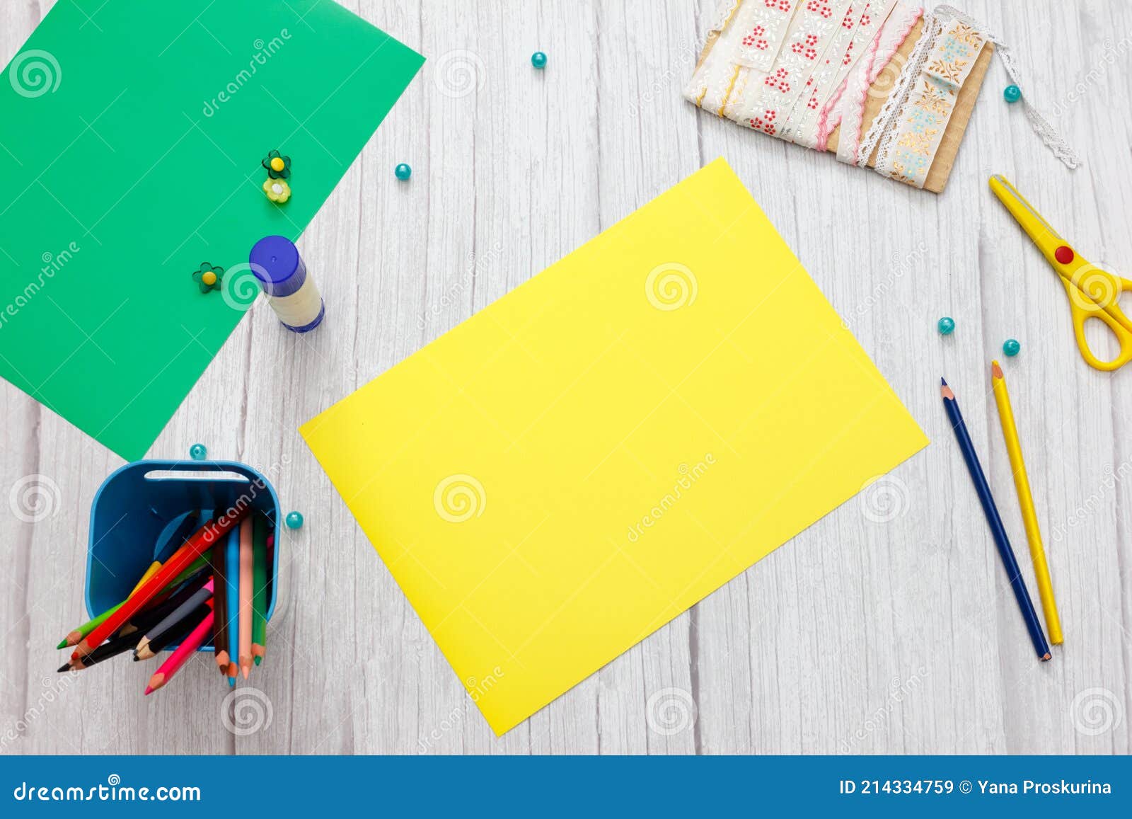 Objects on the Table Top View. Yellow Sheet of Paper, Pencils Stock ...