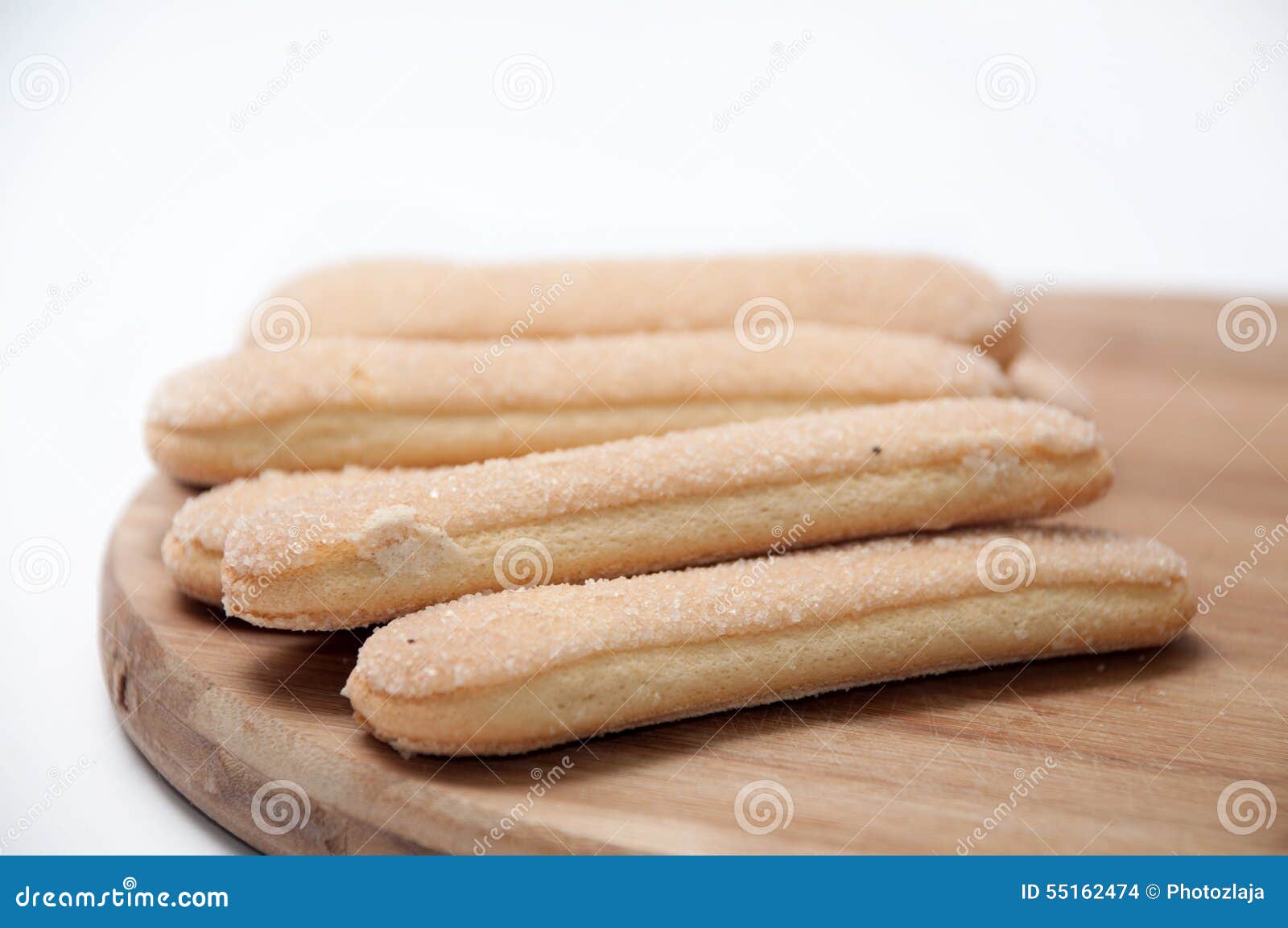 Oblong Cakes Lined Up on a Wooden Board Stock Photo - Image of ...