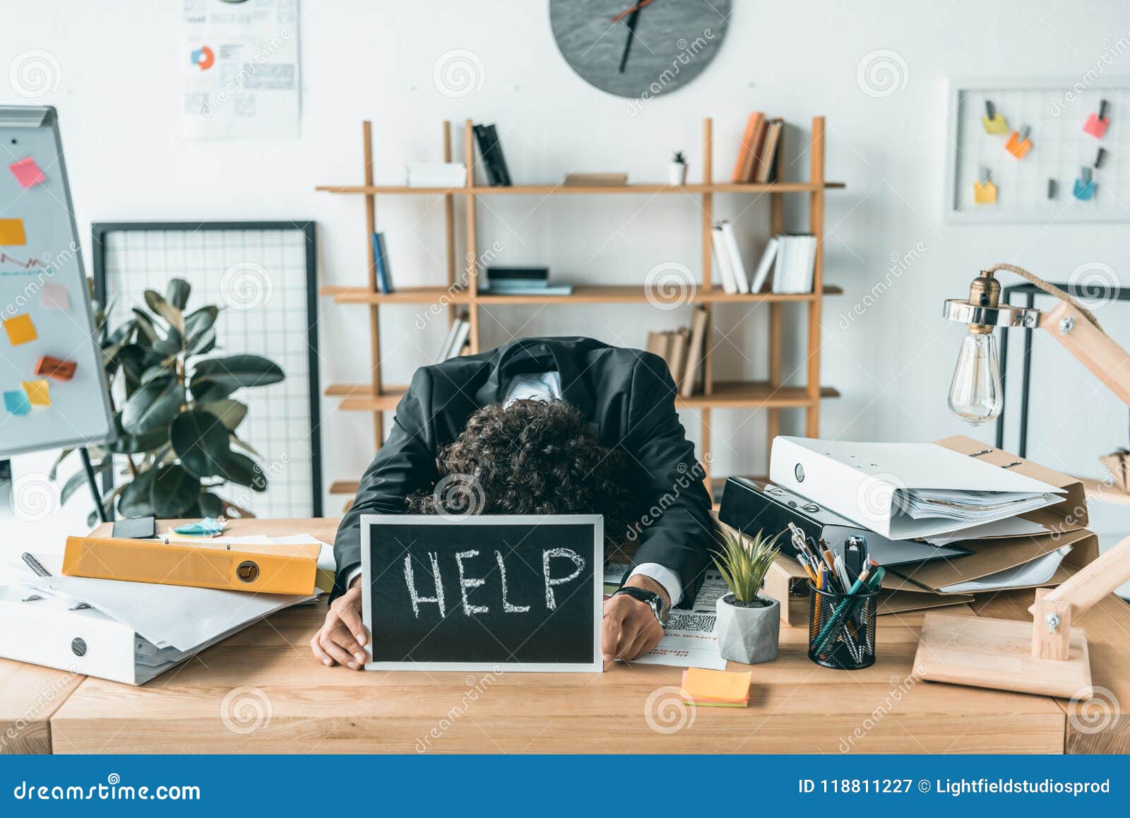 Obscured View of Businessman Lying at Workplace with Help Blackboard in ...