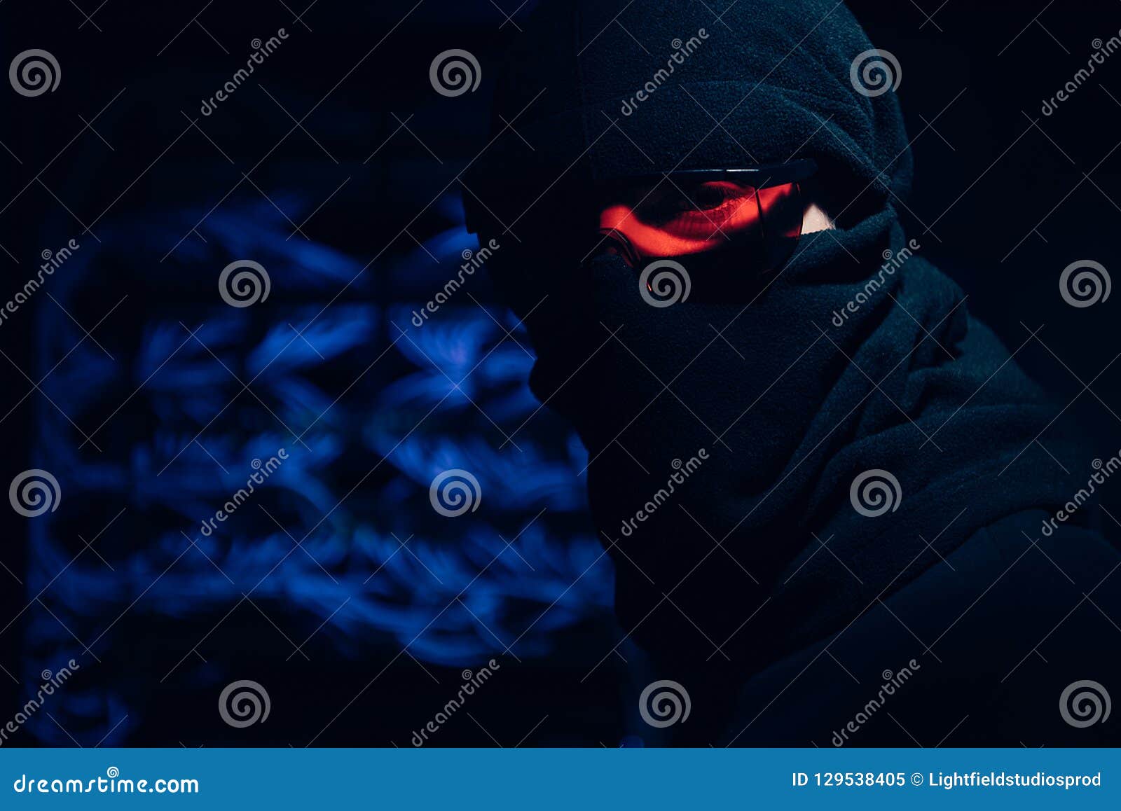 Obscured View of Hacker in Eyeglasses and Mask Looking at Camera with ...
