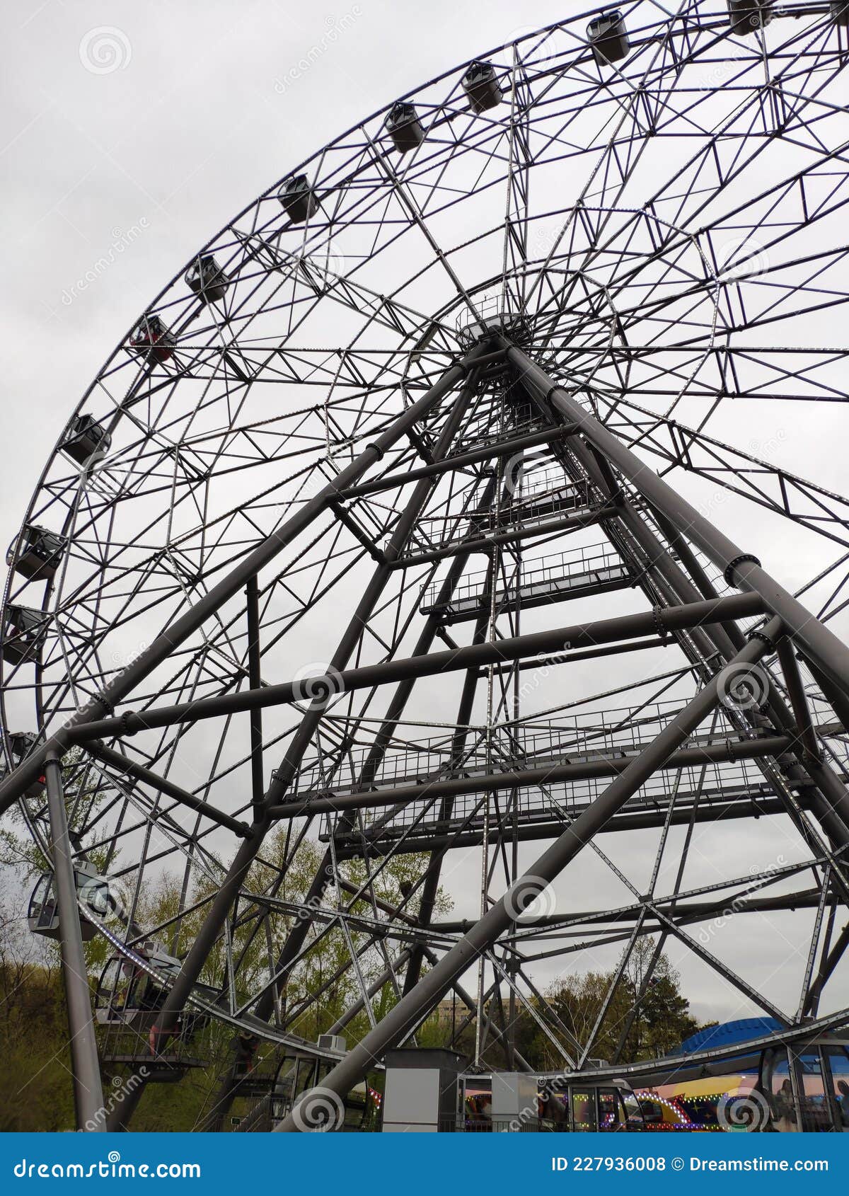 Observation Wheel in Cloudy Weather Stock Photo - Image of line, mast ...