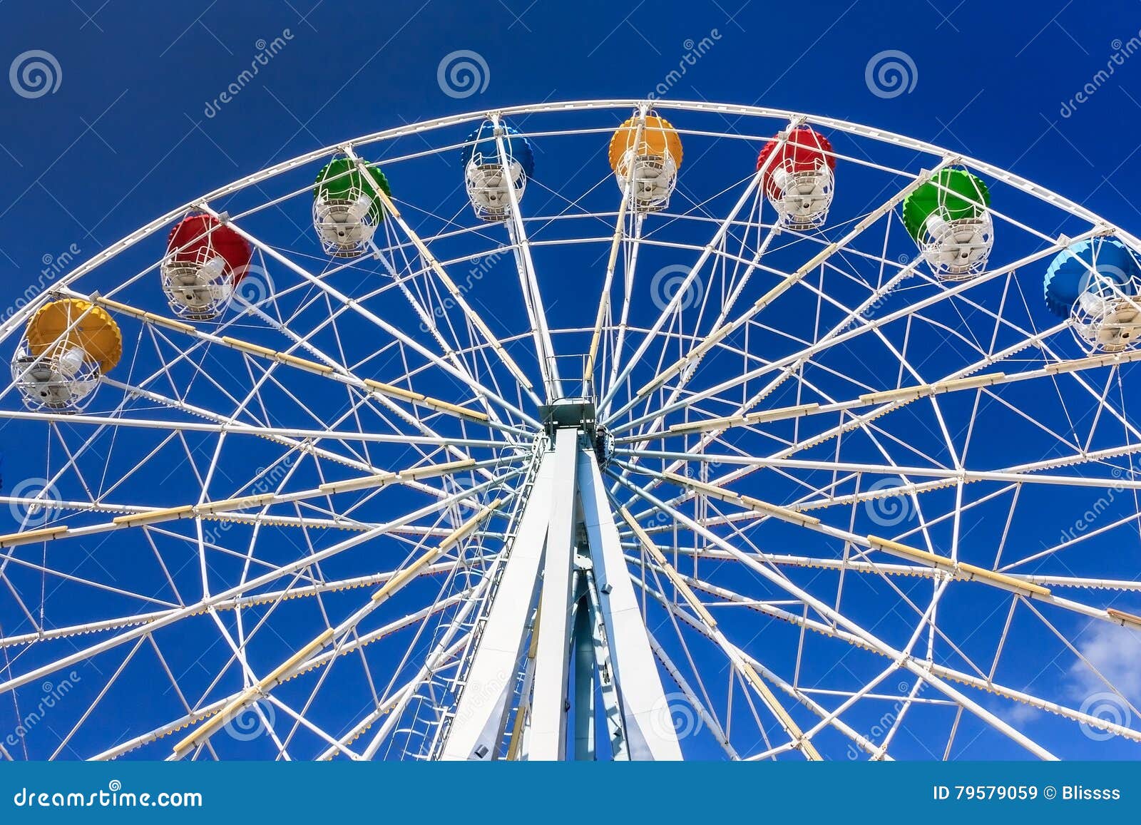 Observation Wheel with Colorful Cabins on the Blue Sky Background Stock ...