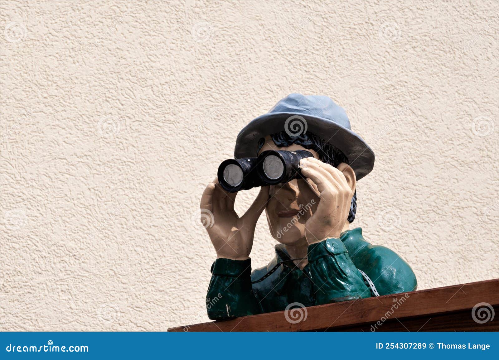 An Observer is Watching Something in the Distance Using His Binoculars ...