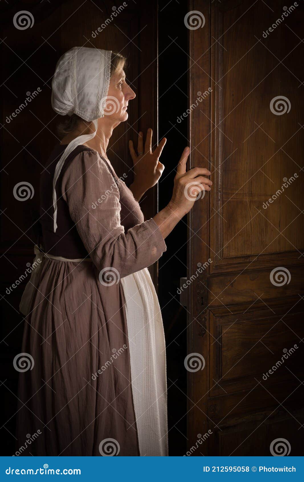 Observing through the door stock photo. Image of people - 212595058