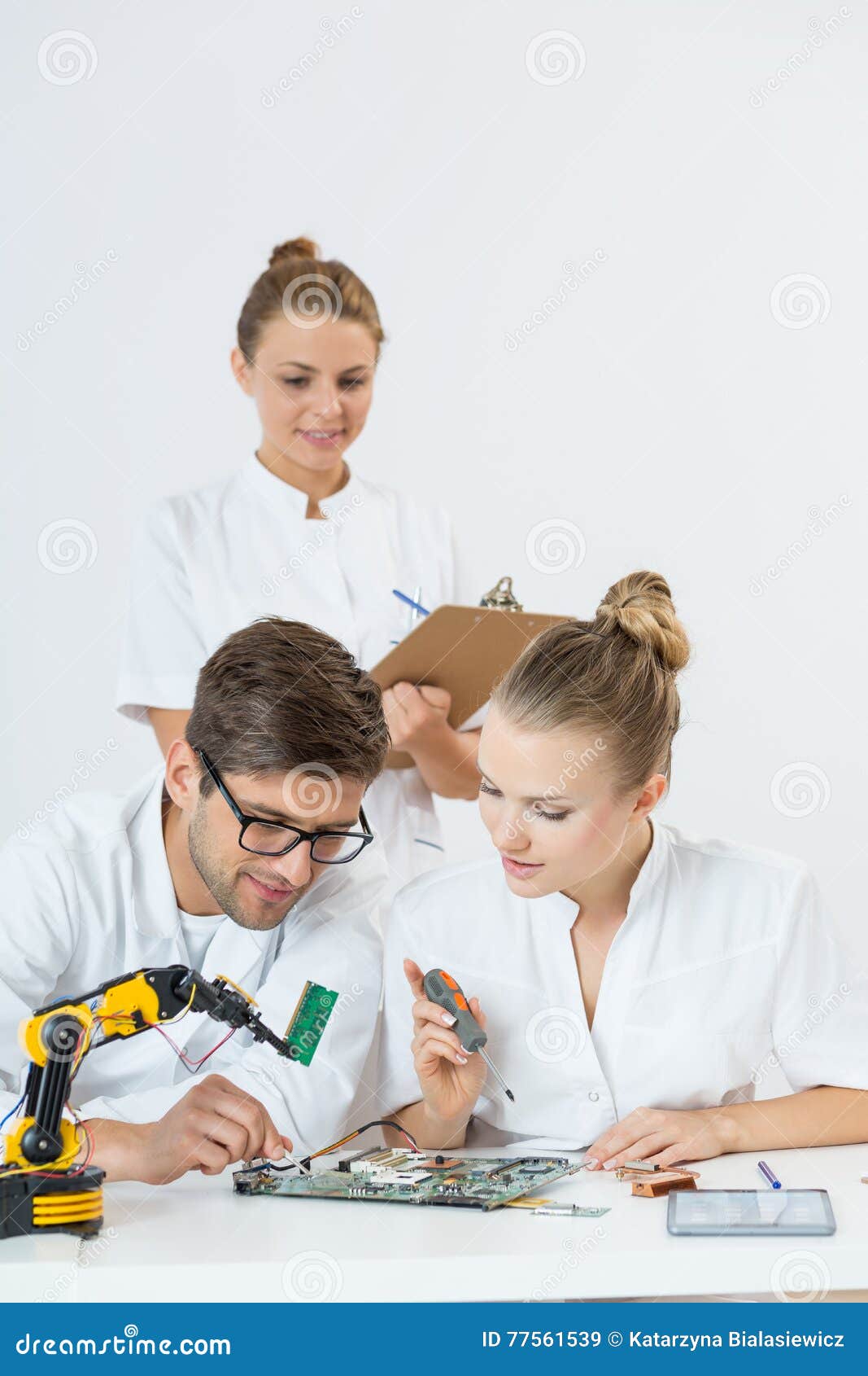 Observing Her Colleagues Work Stock Image - Image of technical, smiling ...