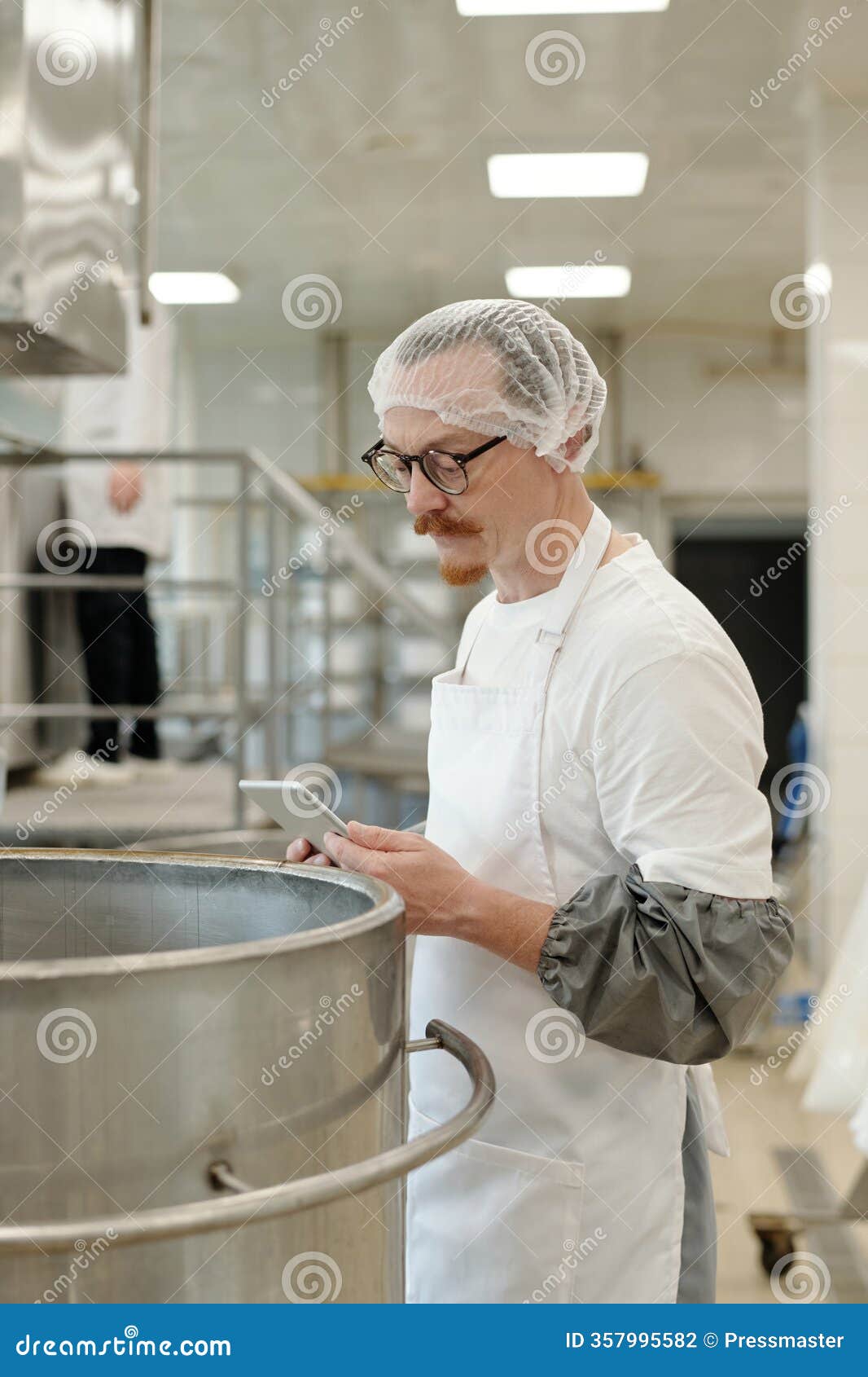 Observing Work in Industrial Kitchen Using Smartphone Stock Photo ...