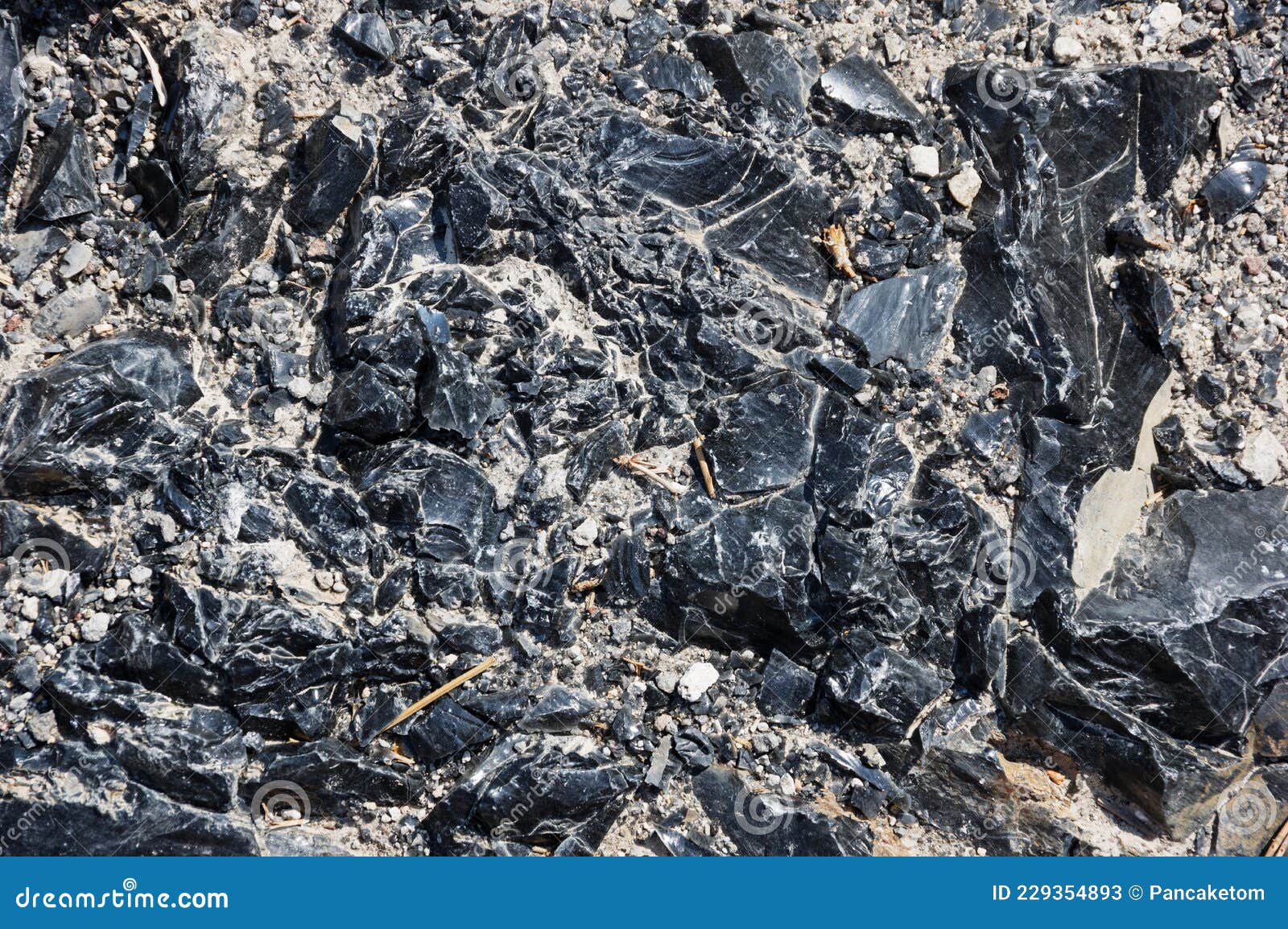 Obsidian on Ground stock image. Image of ground, shattered - 229354893