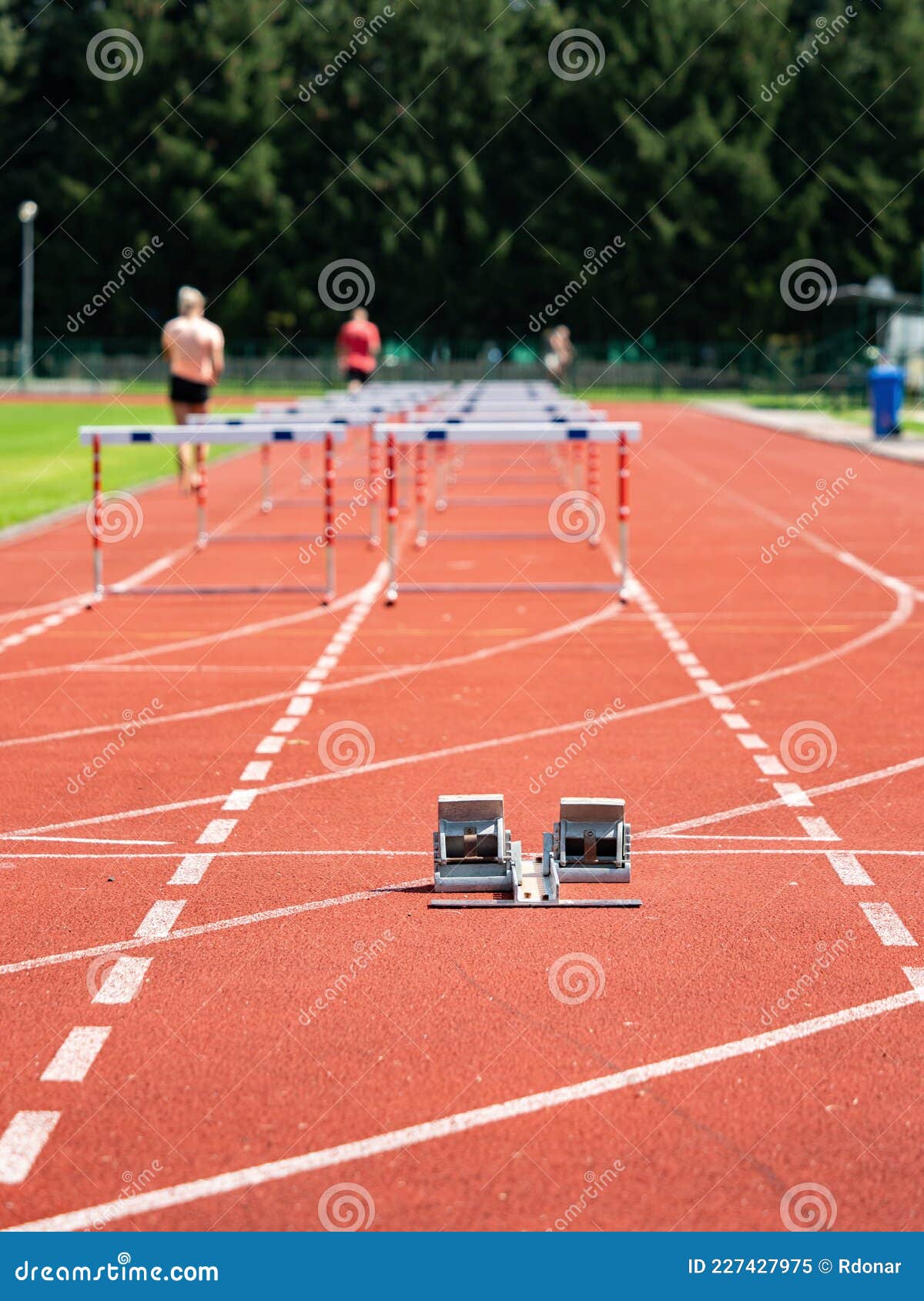 Obstacle Course Training. Athletics Starting Blocks and Red Running ...